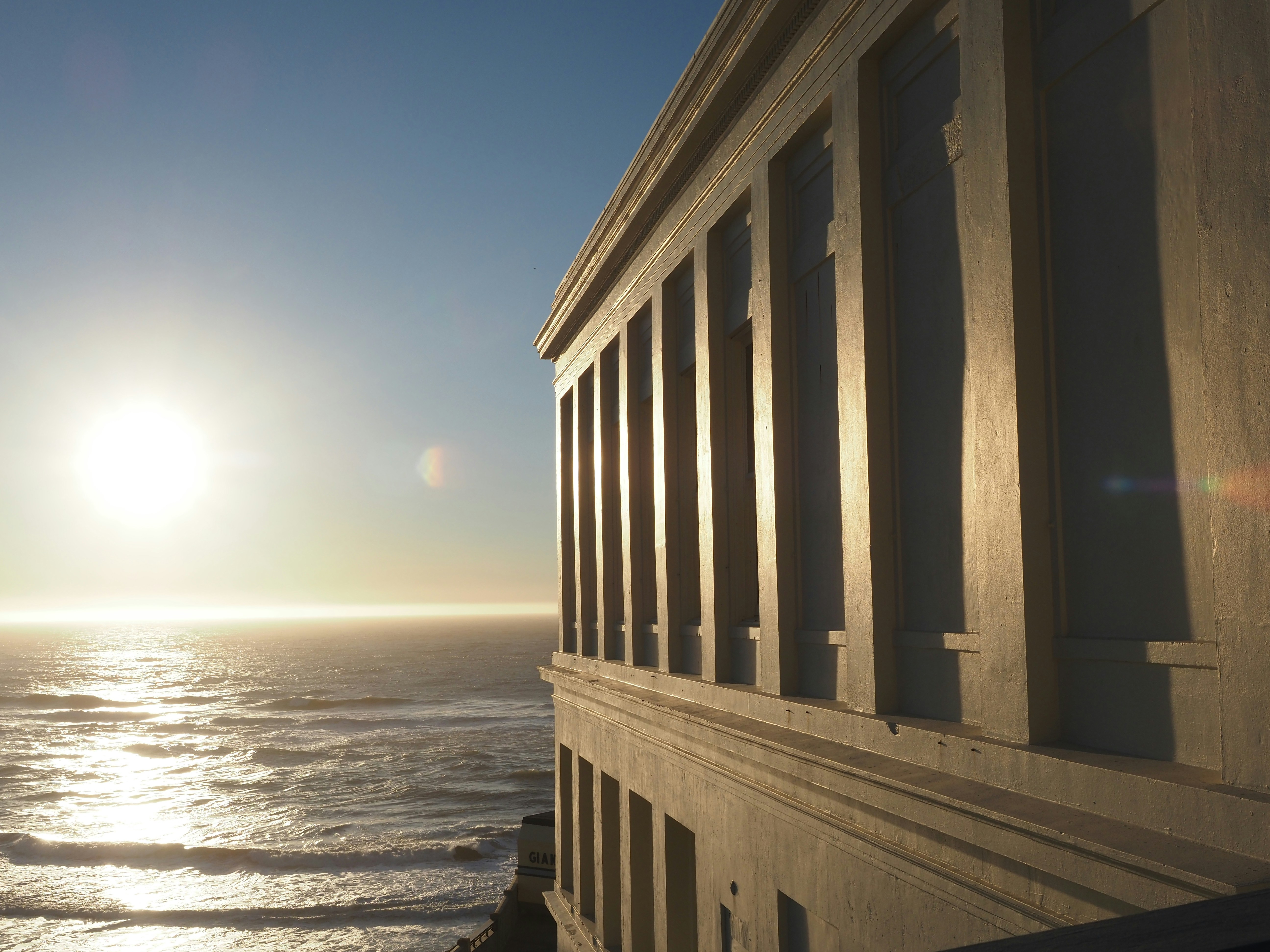 Sunlit Atlantic Facade: Columns against the Sea