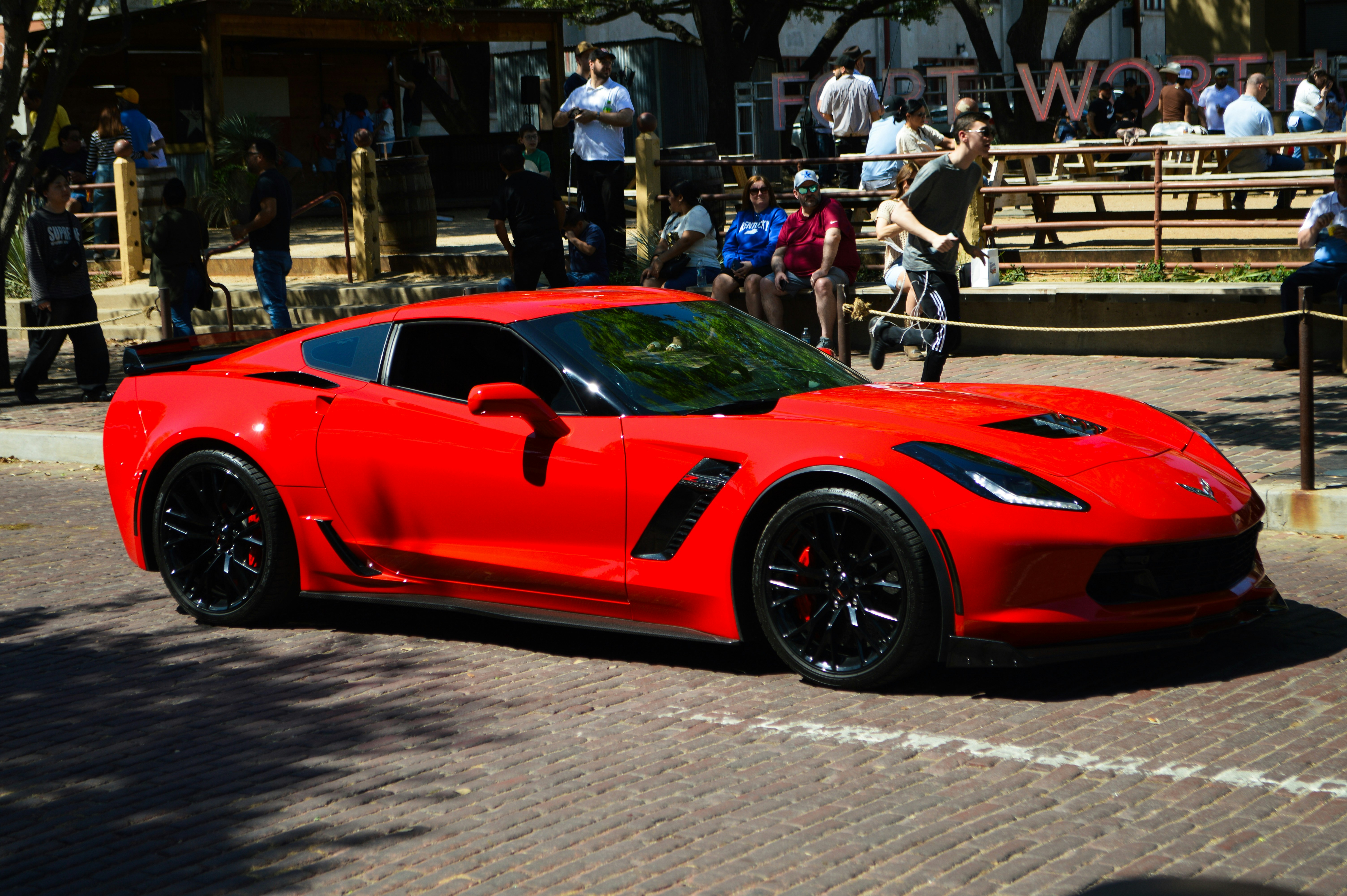 Scarlet Veloce: A Striking Red Corvette at a Street Car Show