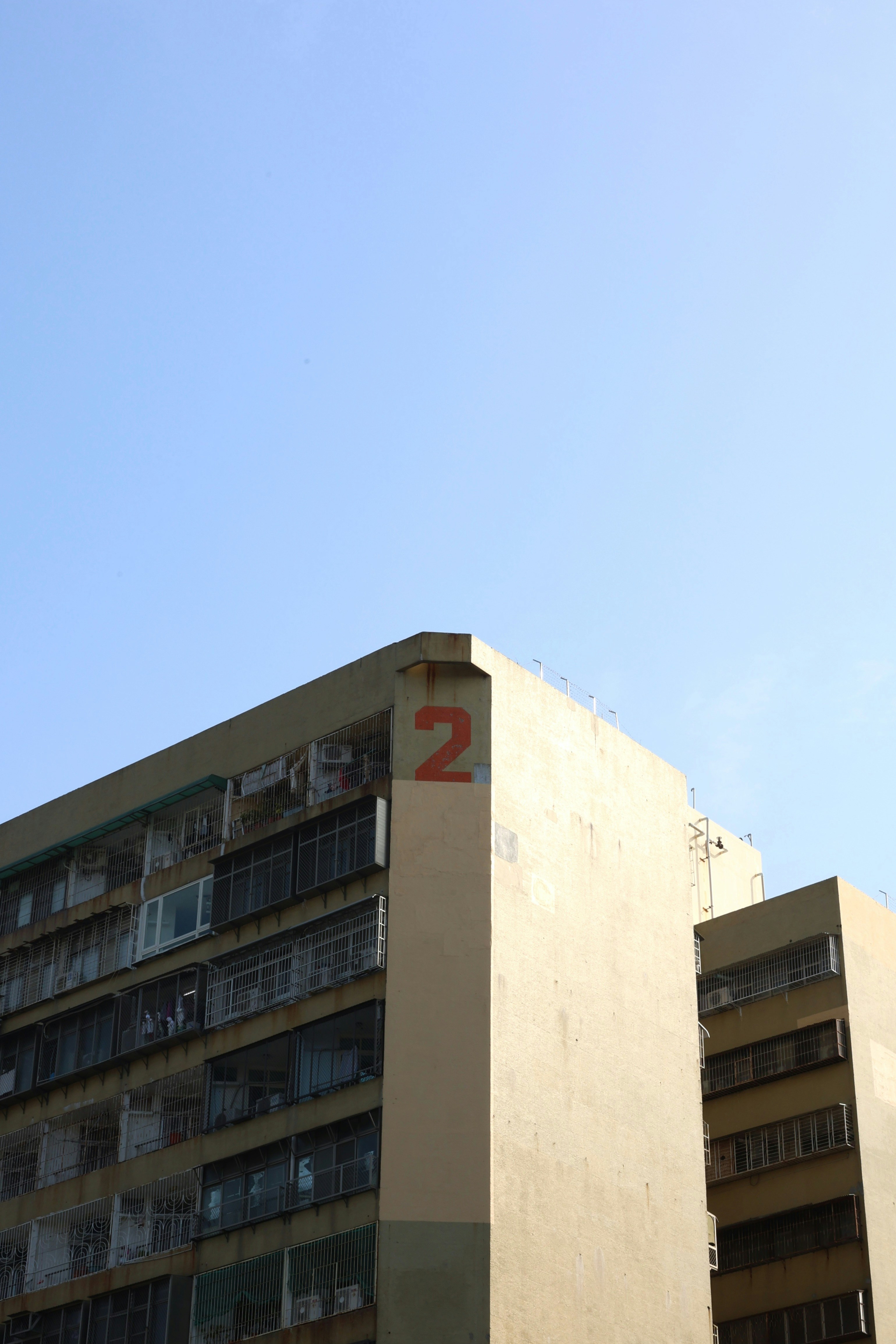 Concrete Shelter with a Red 2 Gazing at a Clear Sky