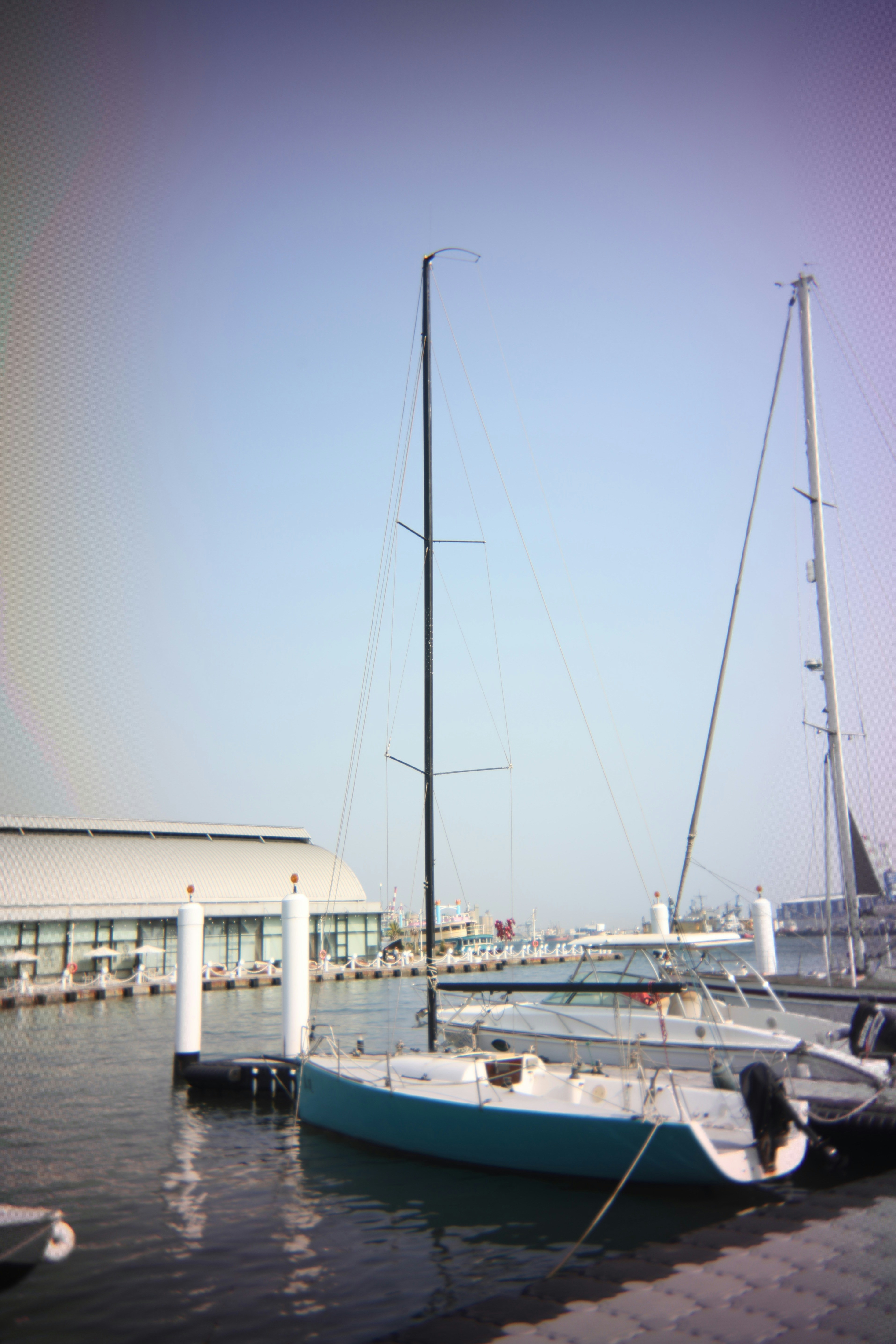 Sailboats at a Quiet Marina with a Soft Halo