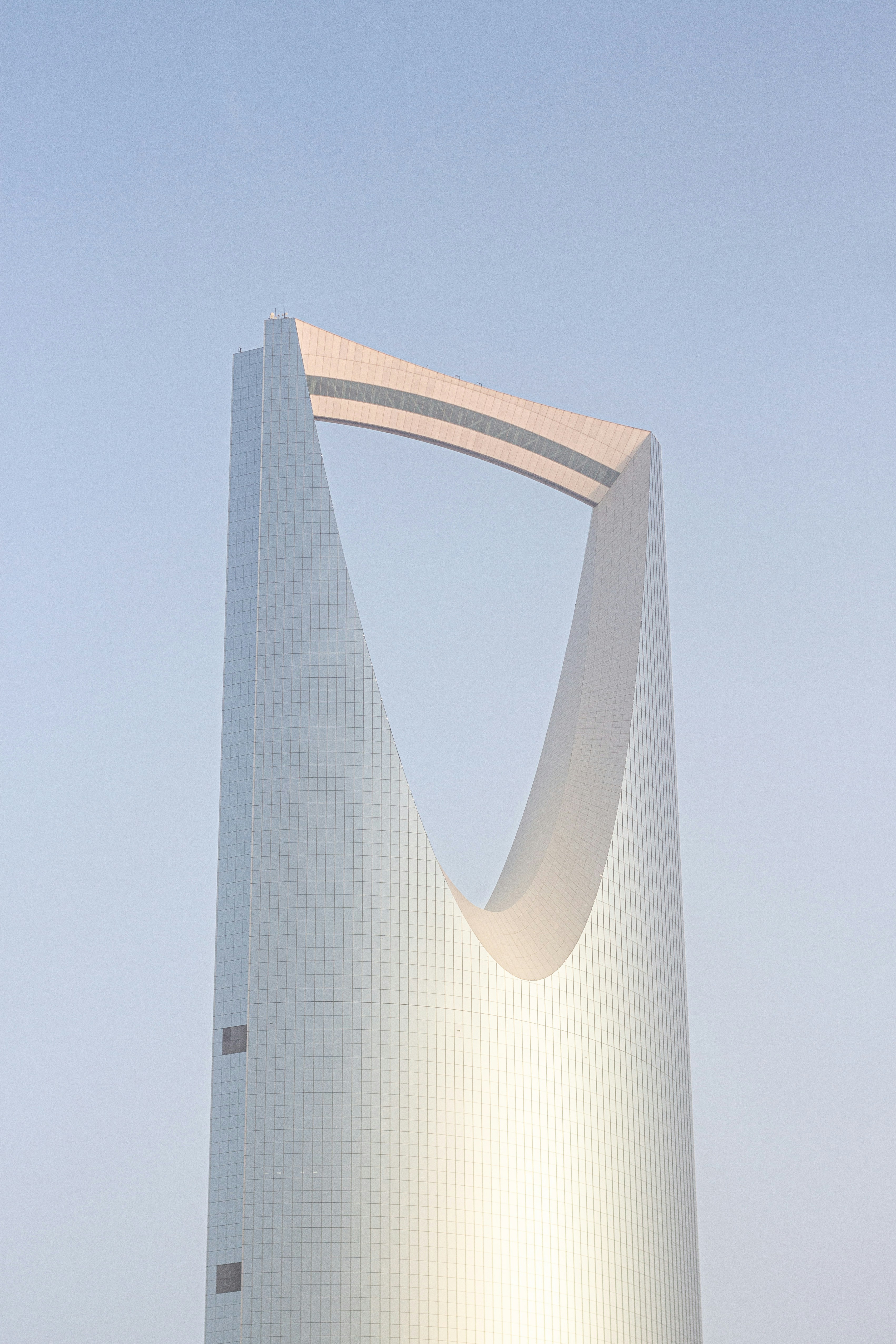 Arrow of the Sky: The Arched Monument Against a Clear Azure