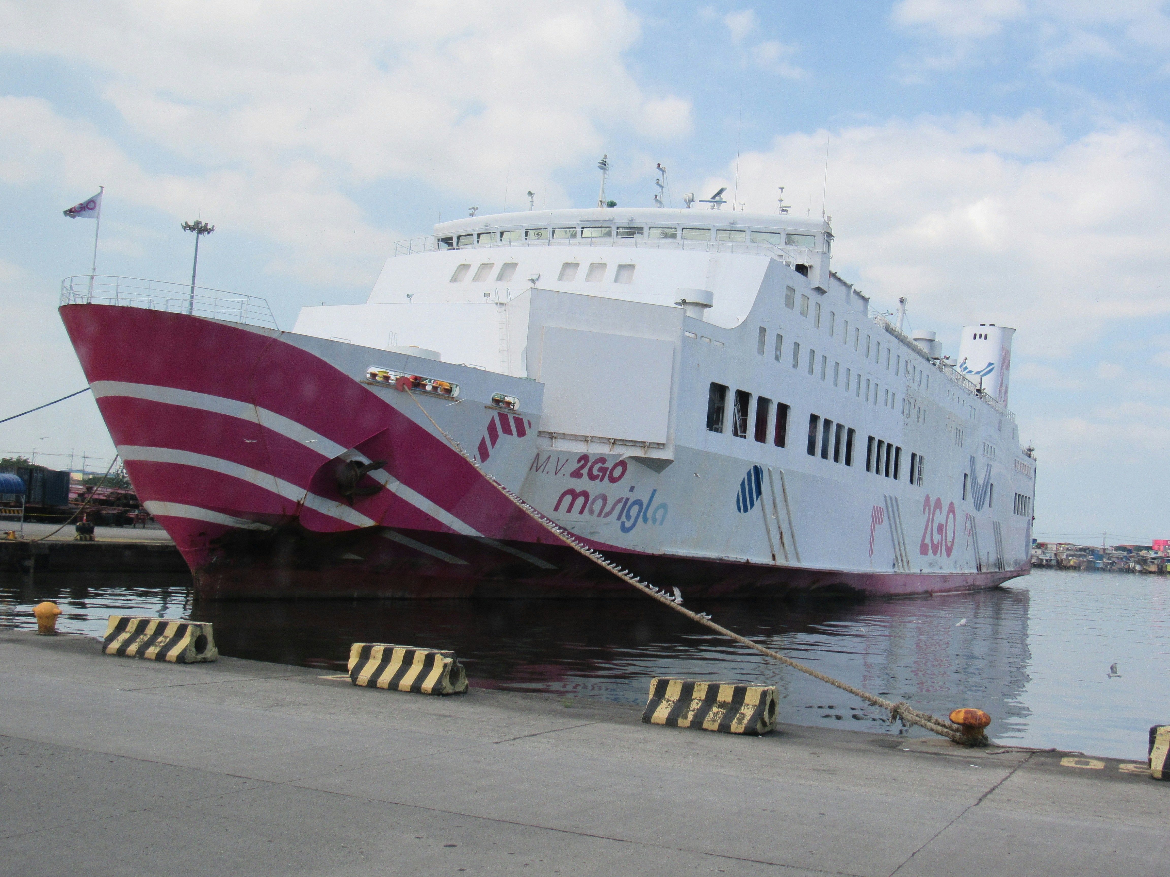 Vessel at Dock: A Coral Ferry Quietly Eased into the Harbor