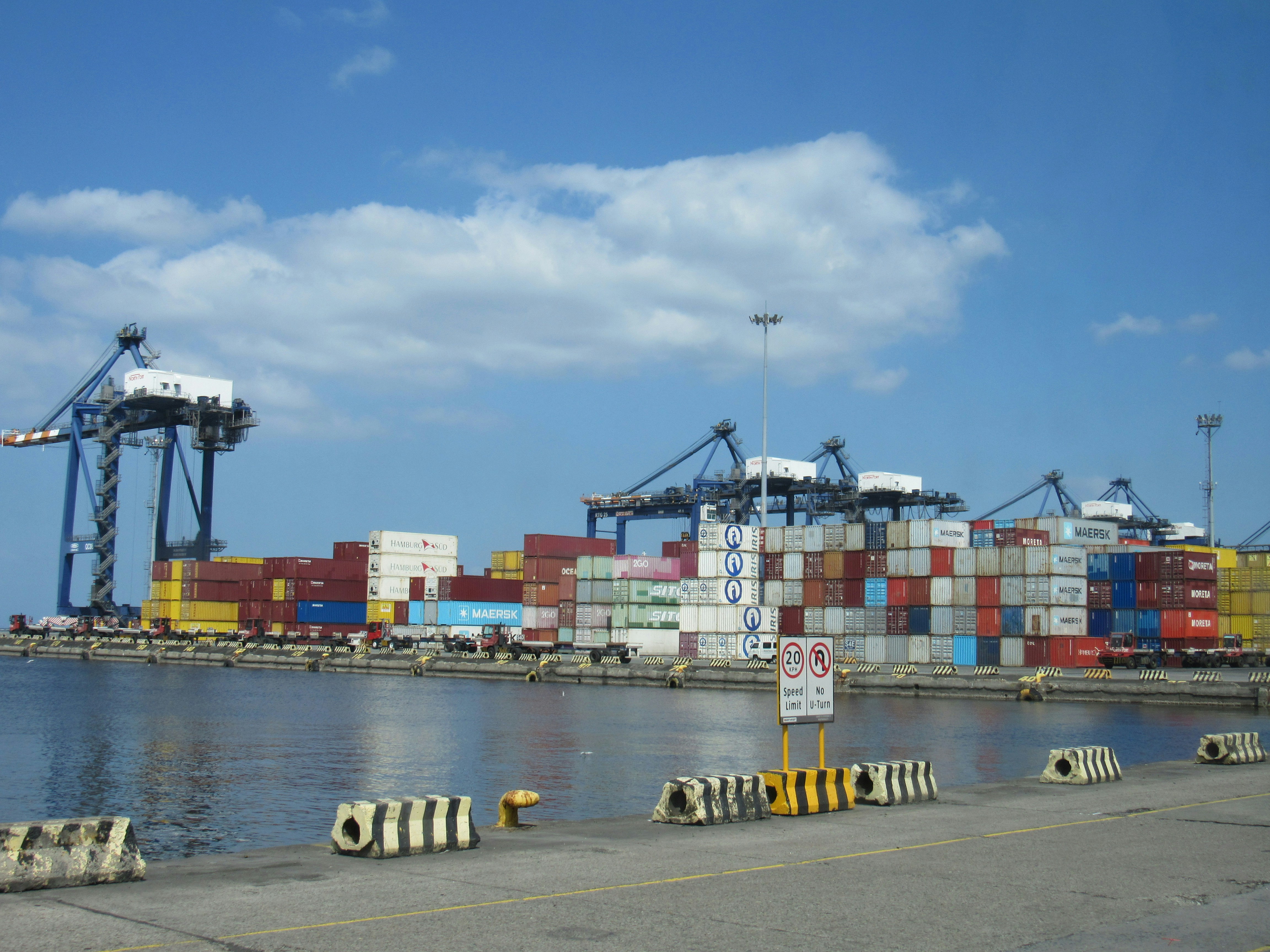 Stacks of Colorful Cargo at Duskless Harbor