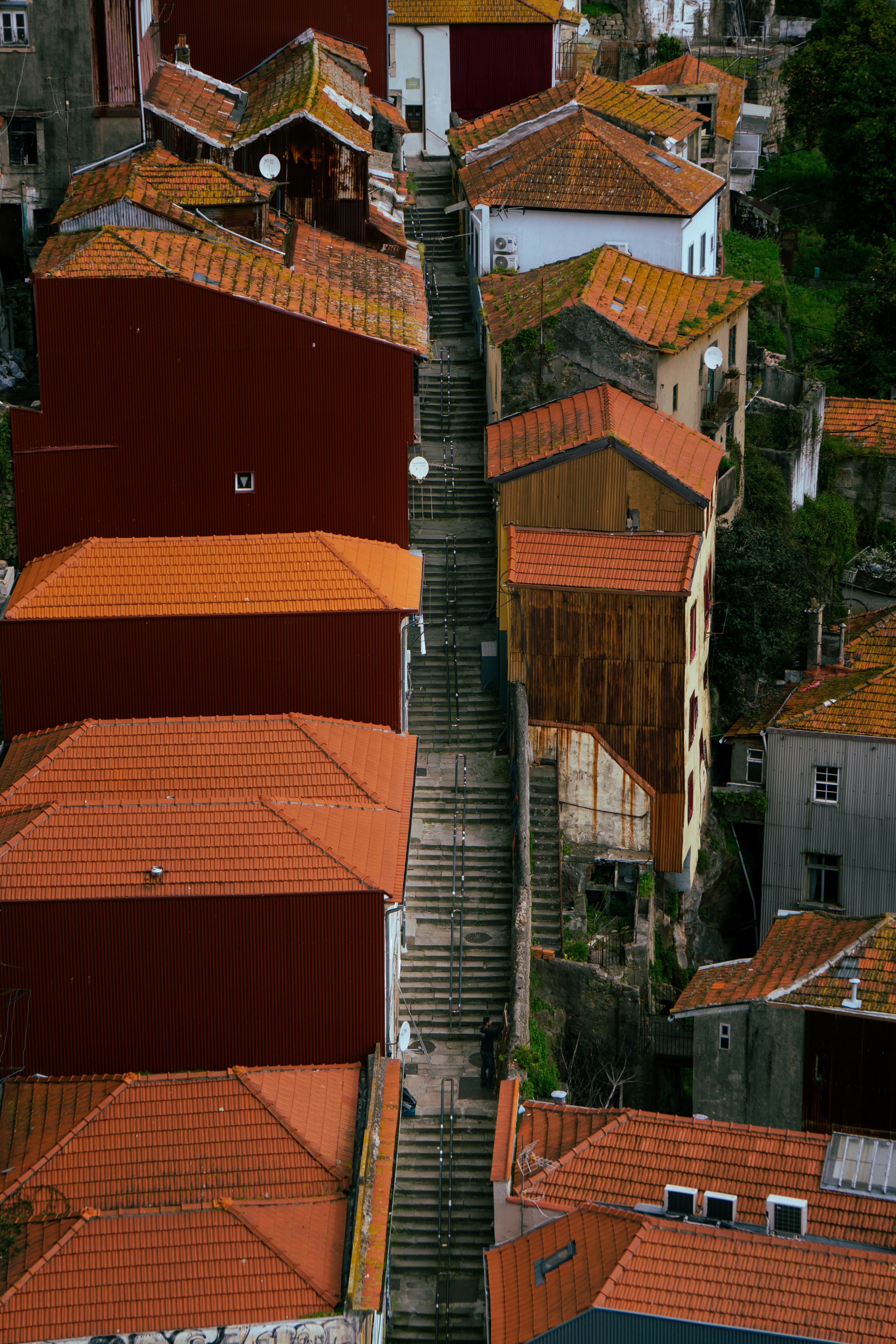 Terraced Roofscape Staircase: A Vertical Village of Orange Tiles