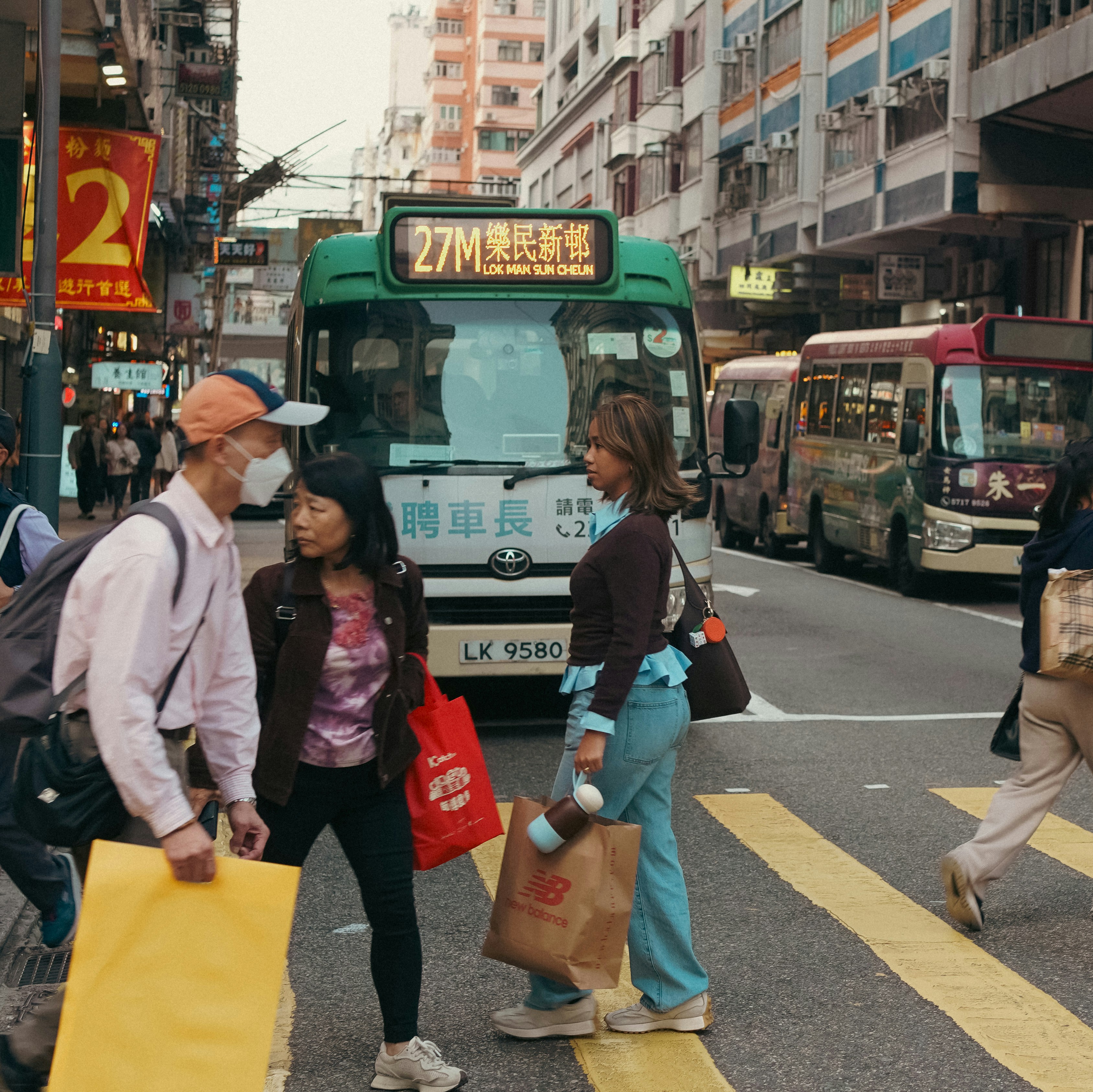 Crossroads of Commerce: Bus Stop Amid City Street Pulse