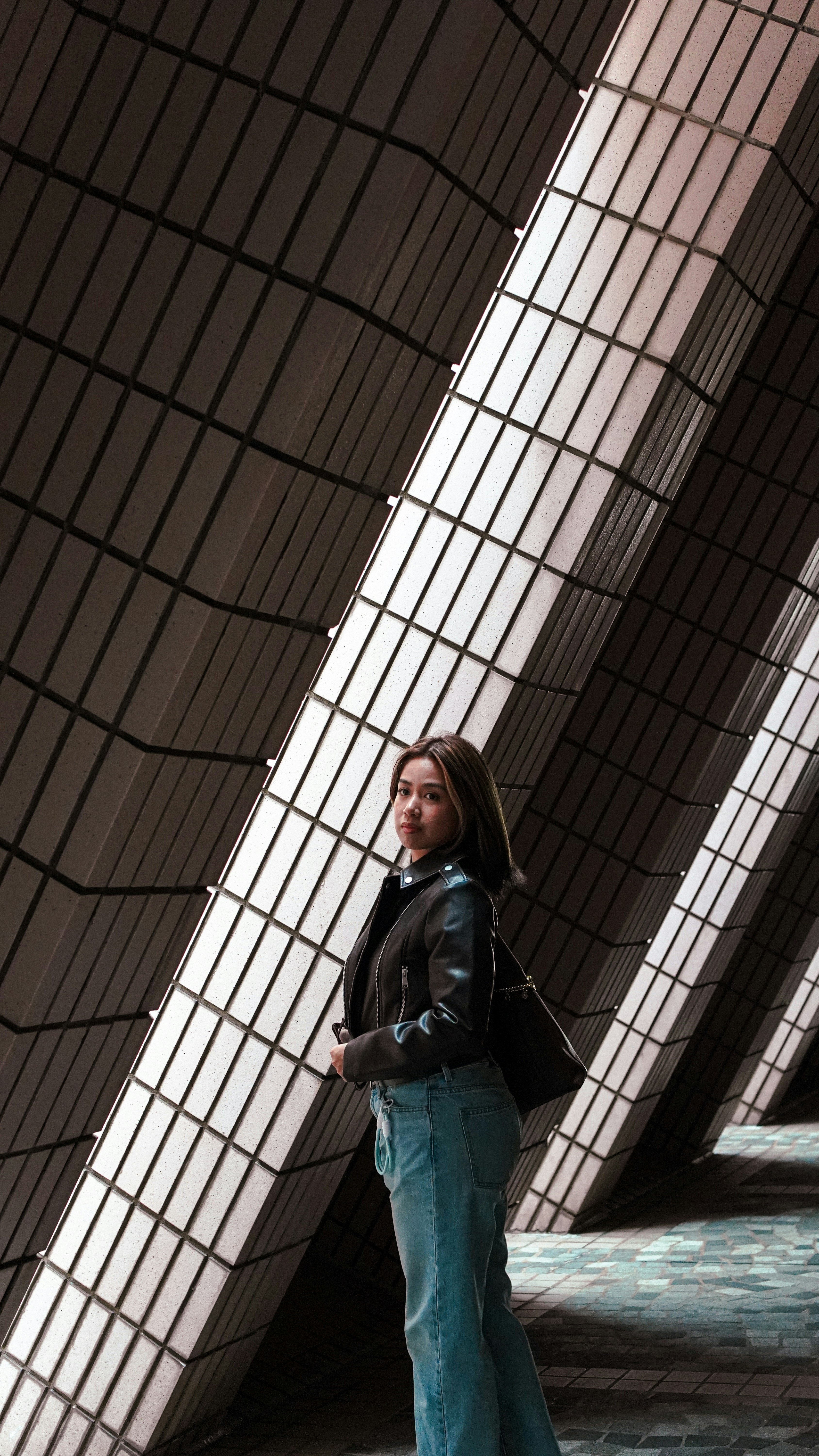 Stride in the Arch: A Portrait Beneath Modern Angles