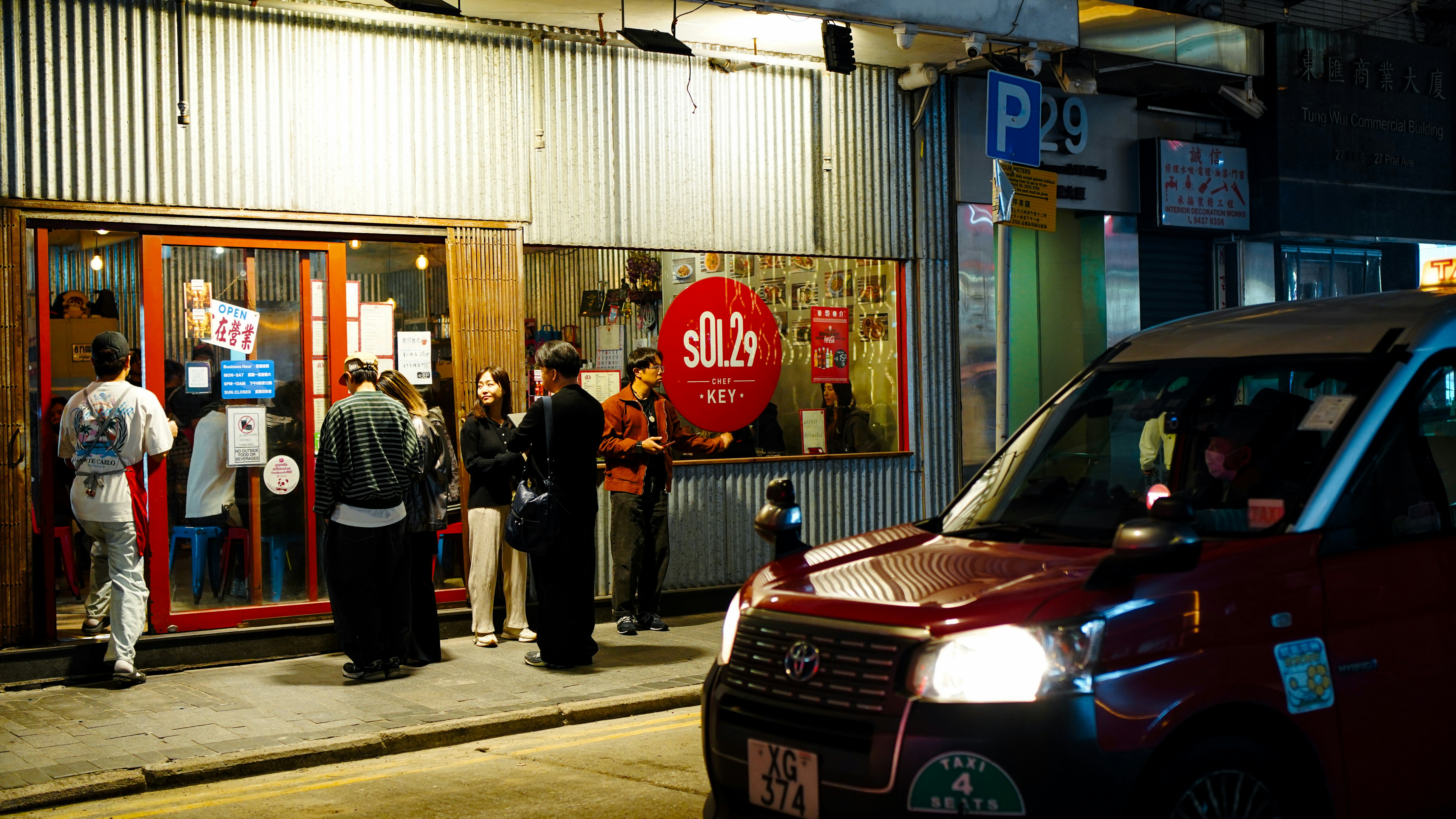Late-Night Queue and Neon Toast: A Warm Glow by the storefront Cafe