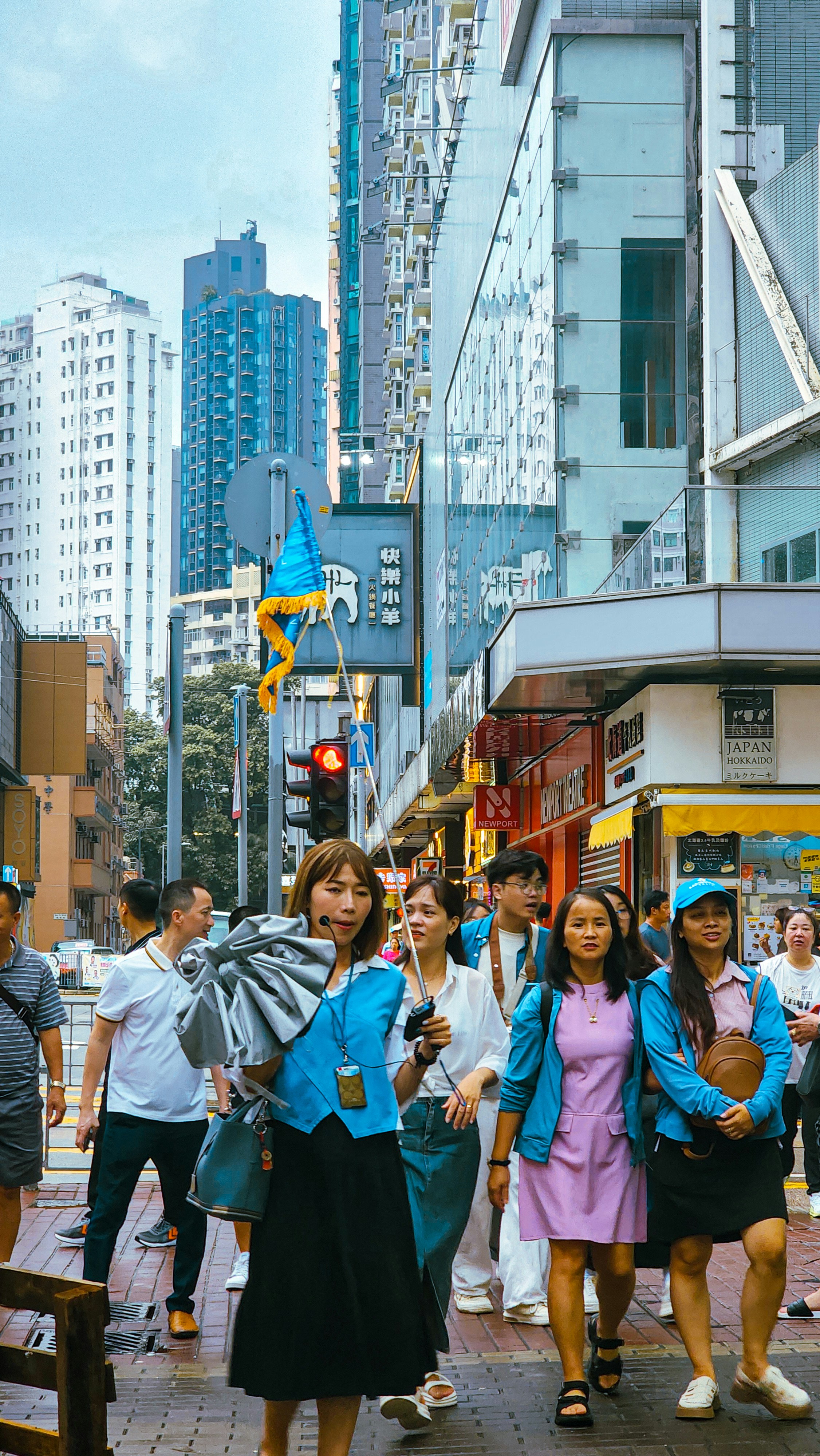  Crossing Pathways: A City Street Scene with a Frontline Crowd