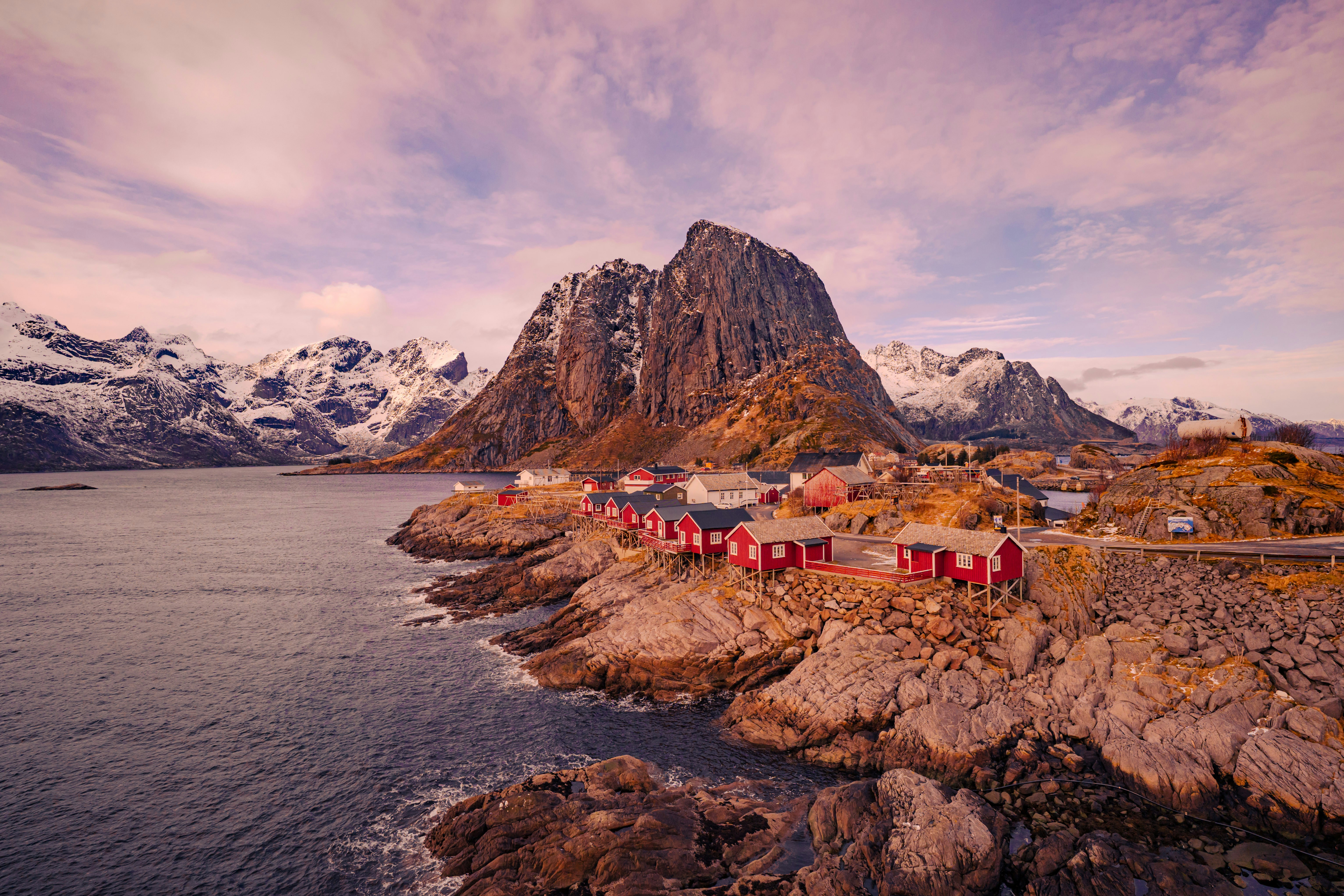 Rocky Coastline Village Beneath a Towering Peak