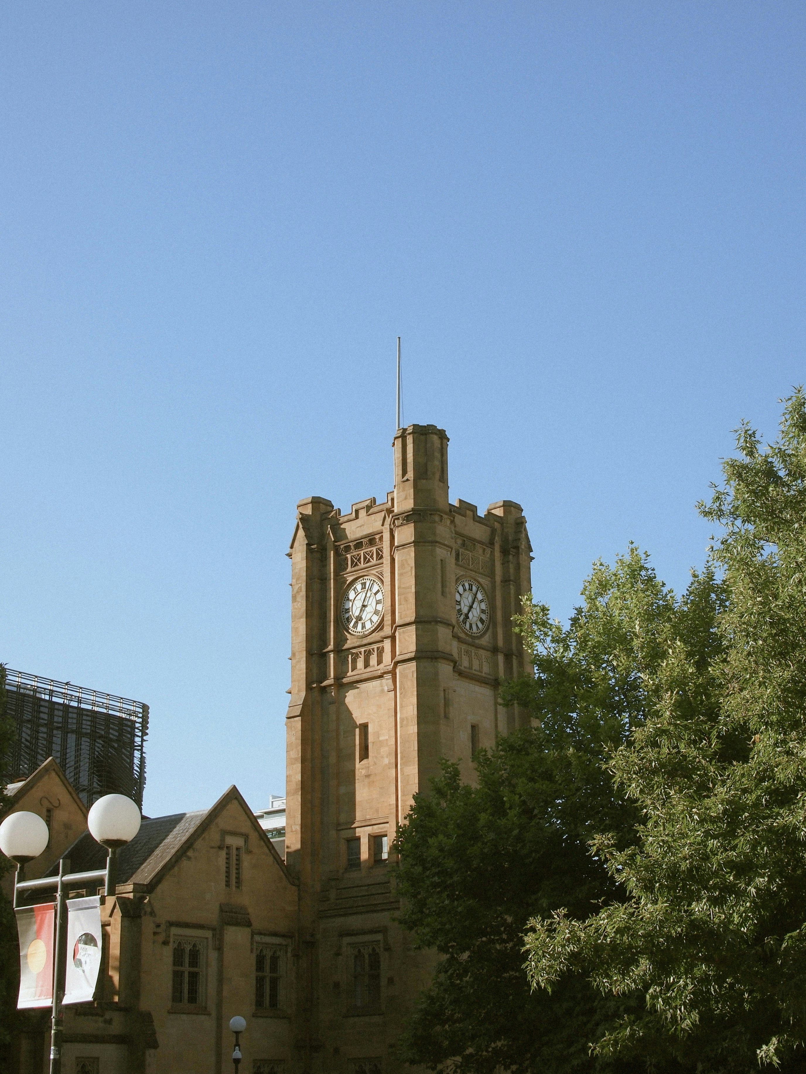 Clock Tower Rising Above a Bright Blue Sky