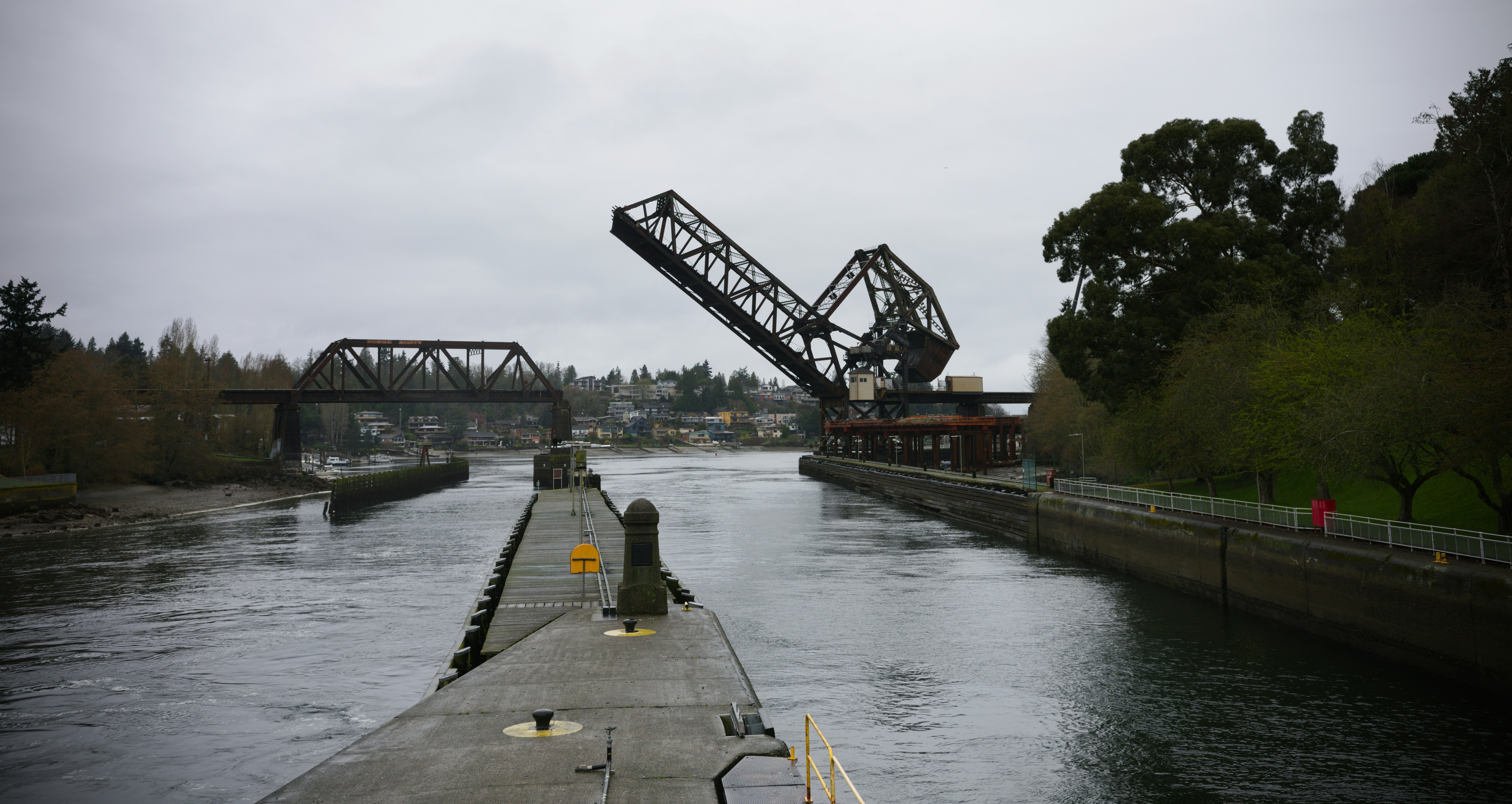 The Lifting Arm over the River: A Quiet Canal Scene with a Striding Bridge