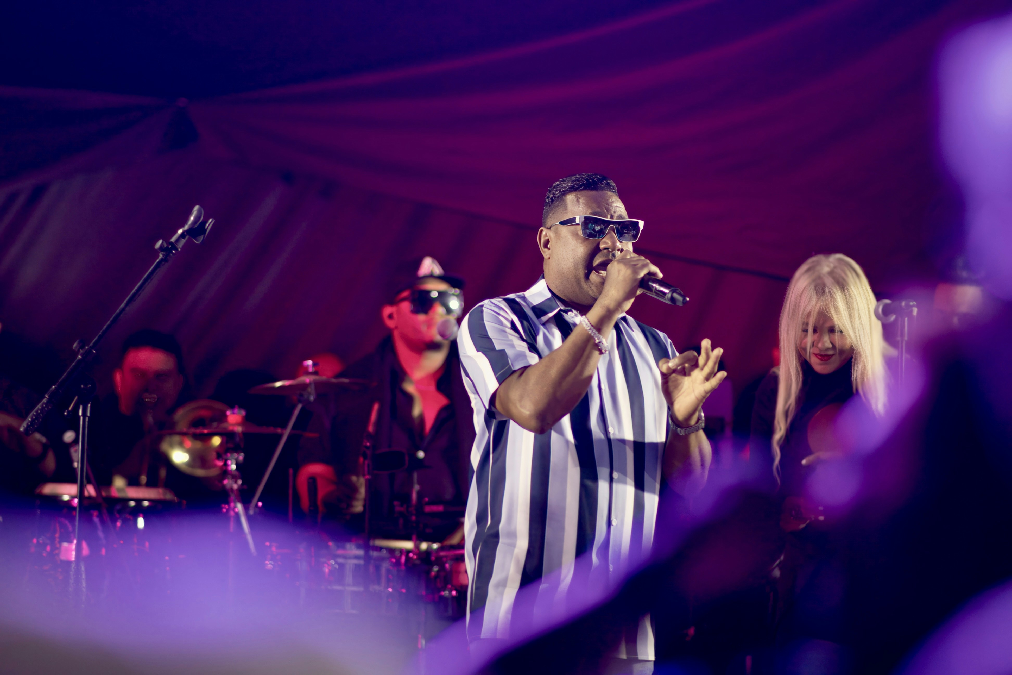 Midnight Pulse: A Striped Microphone Moment on Stage