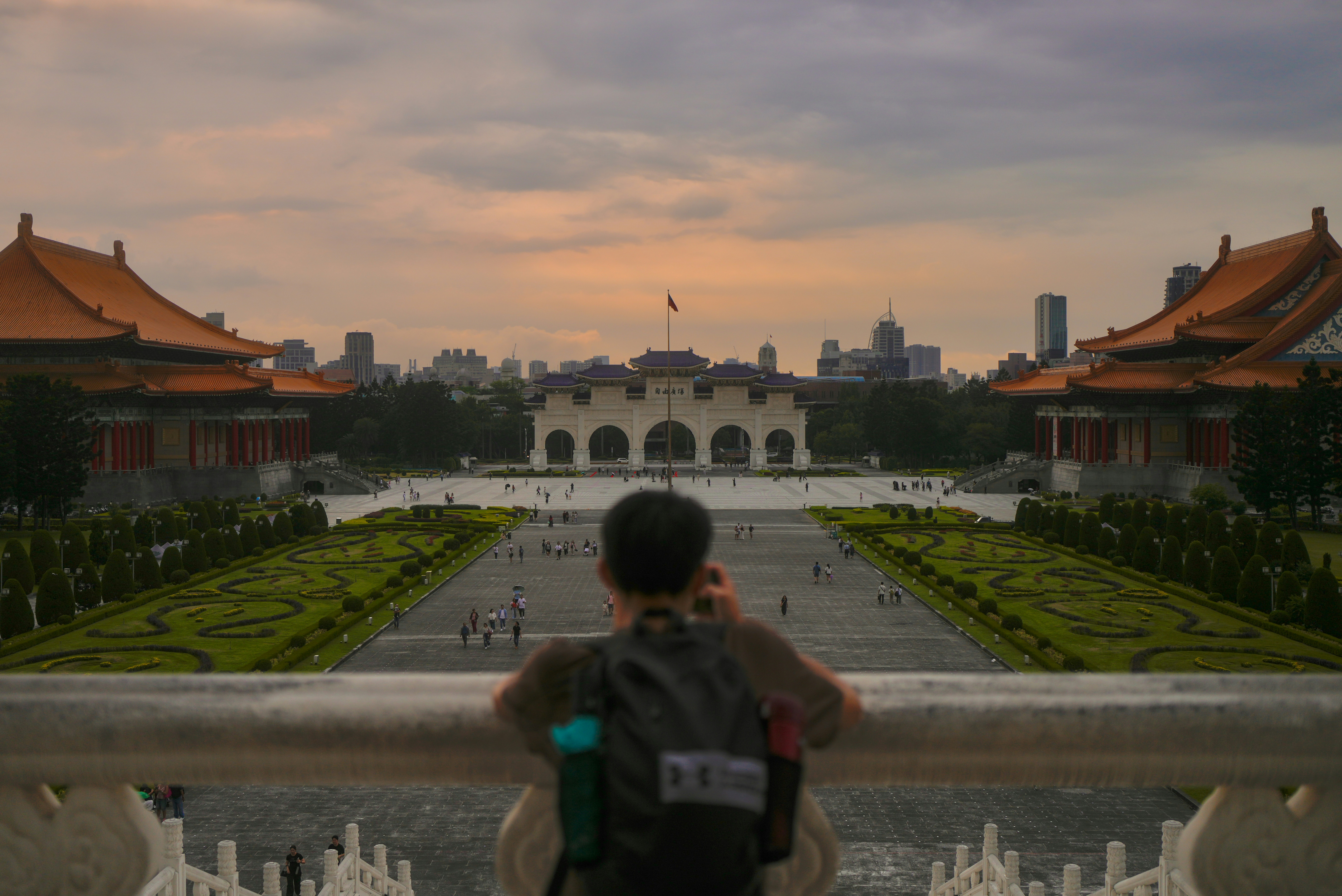 At the Threshold: A Traveler Framing the Sunlit Courtyard of the Forbidden City