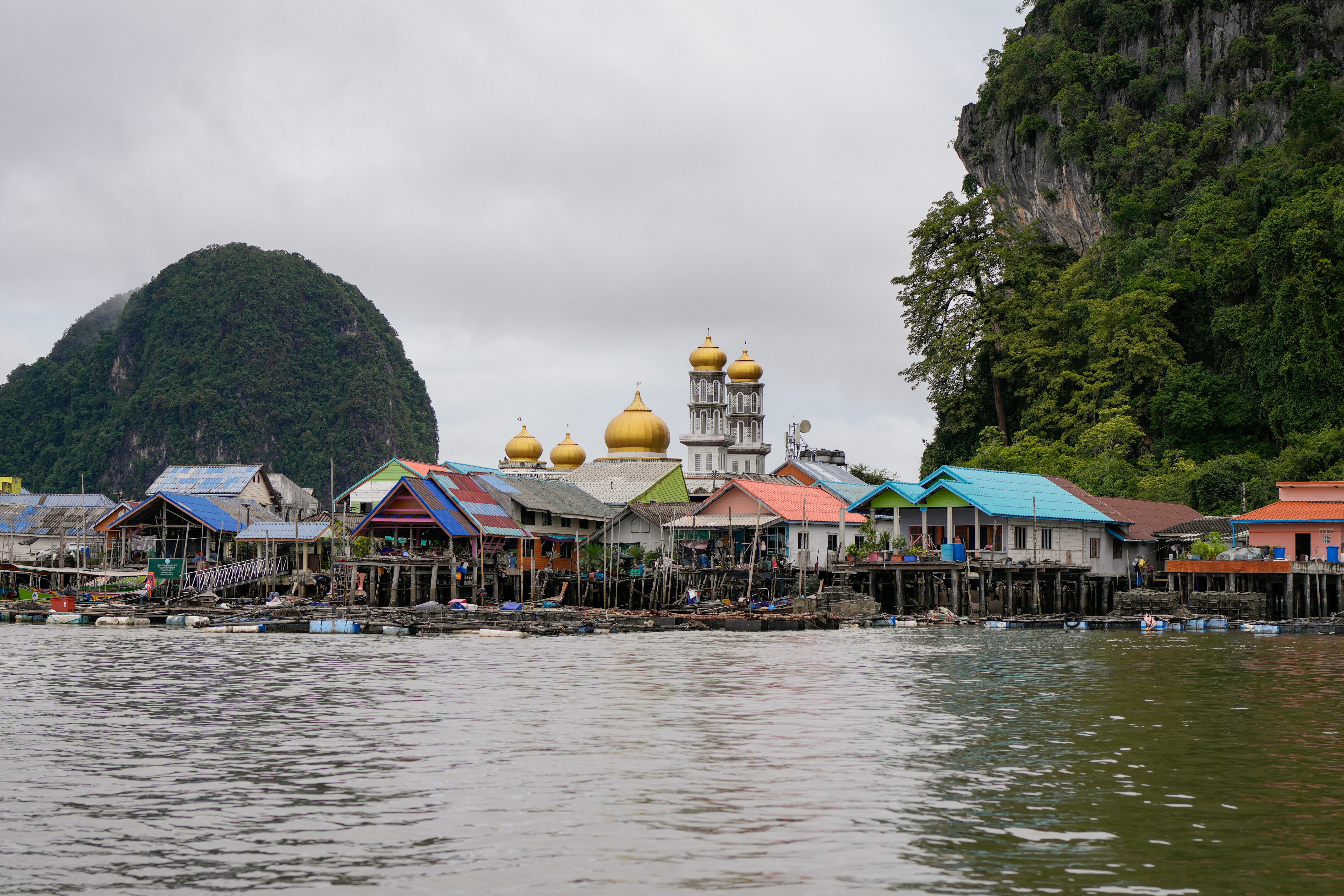 Colorful Stilt Village by the Turquoise Bay