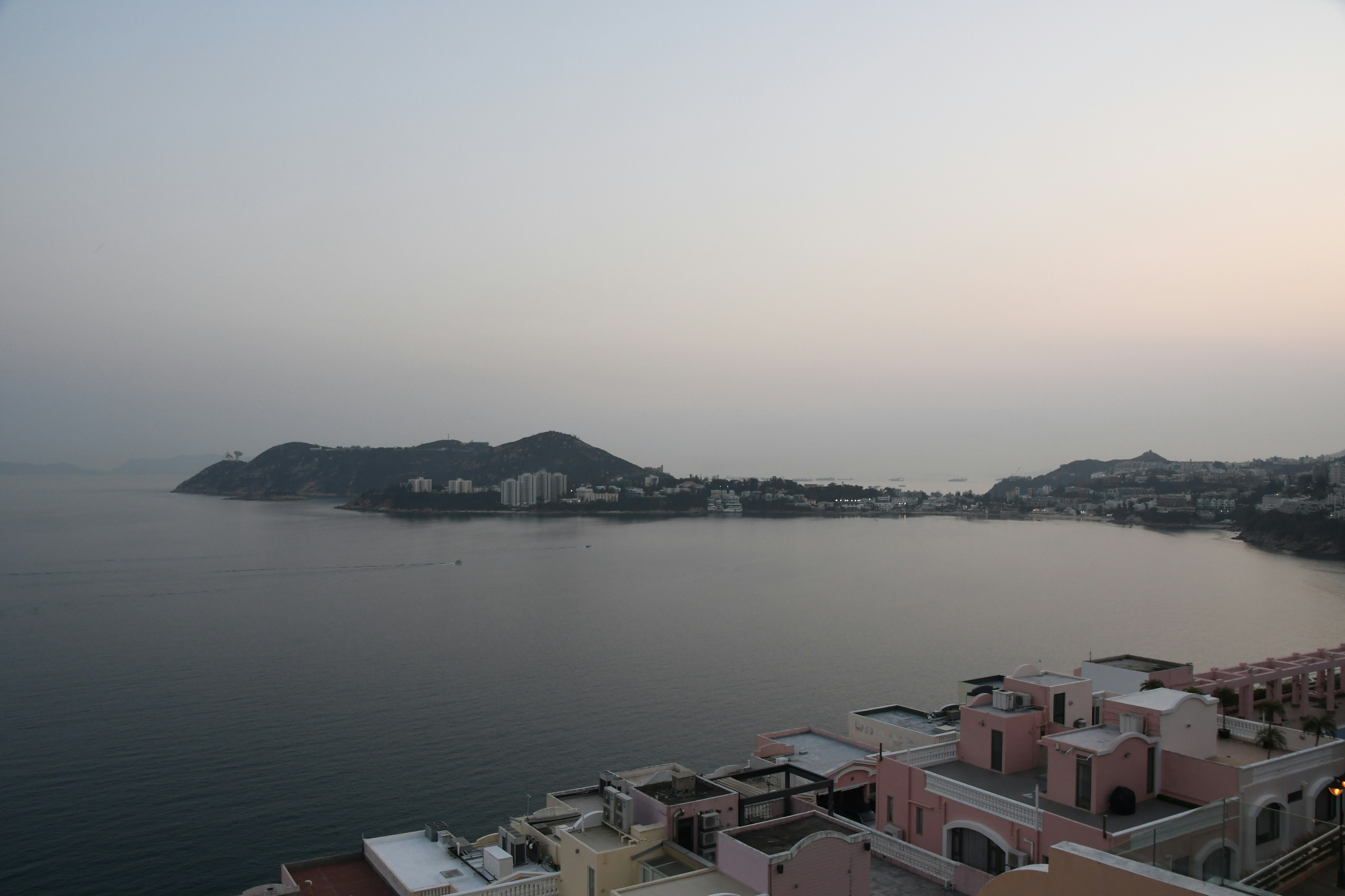 Harbor Rim at Dusk: Subtle Palette Over Waterfront Housing