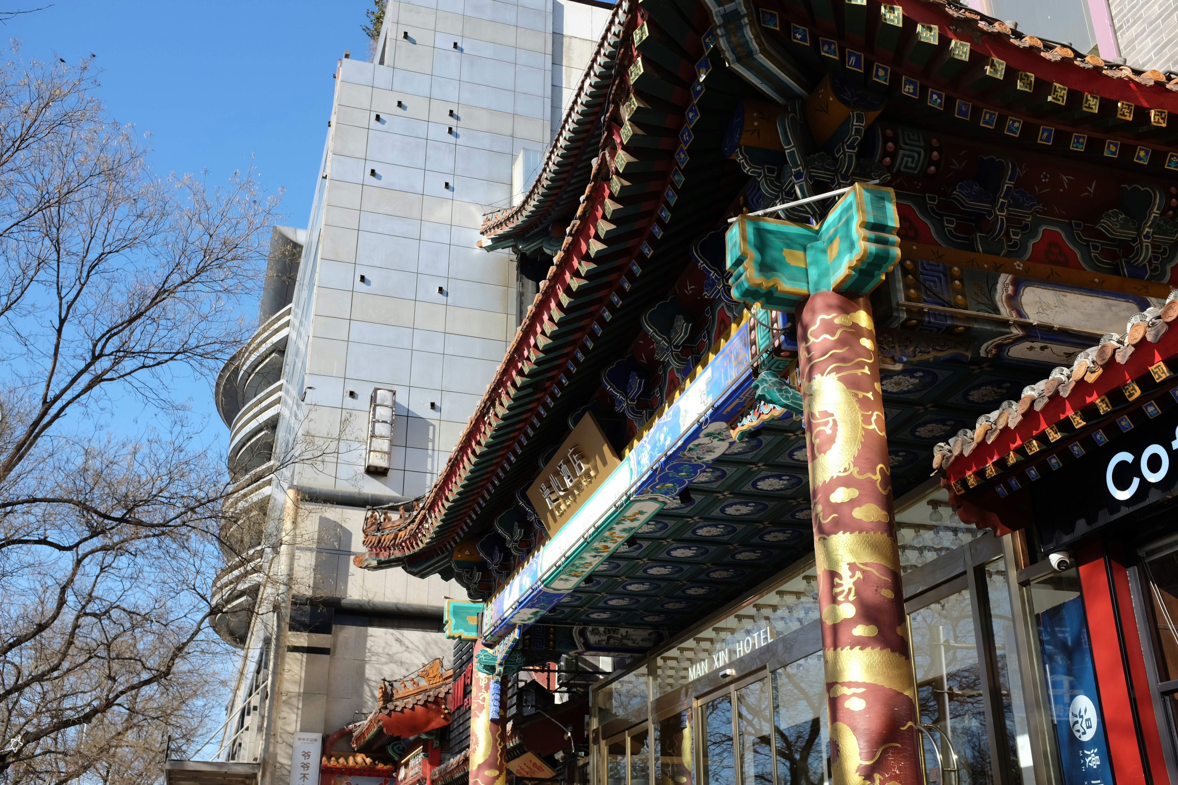 Ornate Chinatown Archway Framing a Modern Urban Street