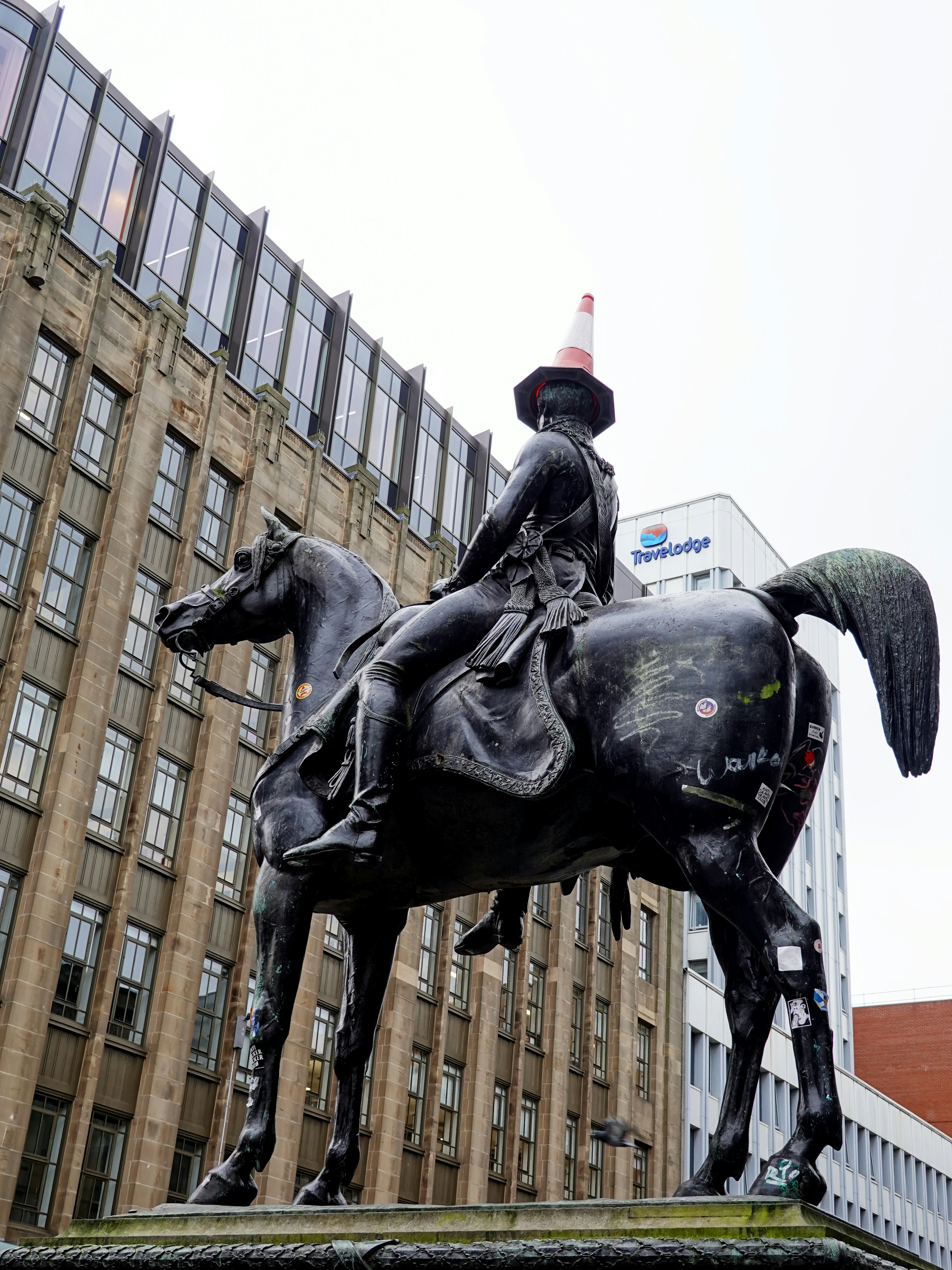 Equestrian Statue Under Snowy Sky with Traffic Cone (City Silence)
