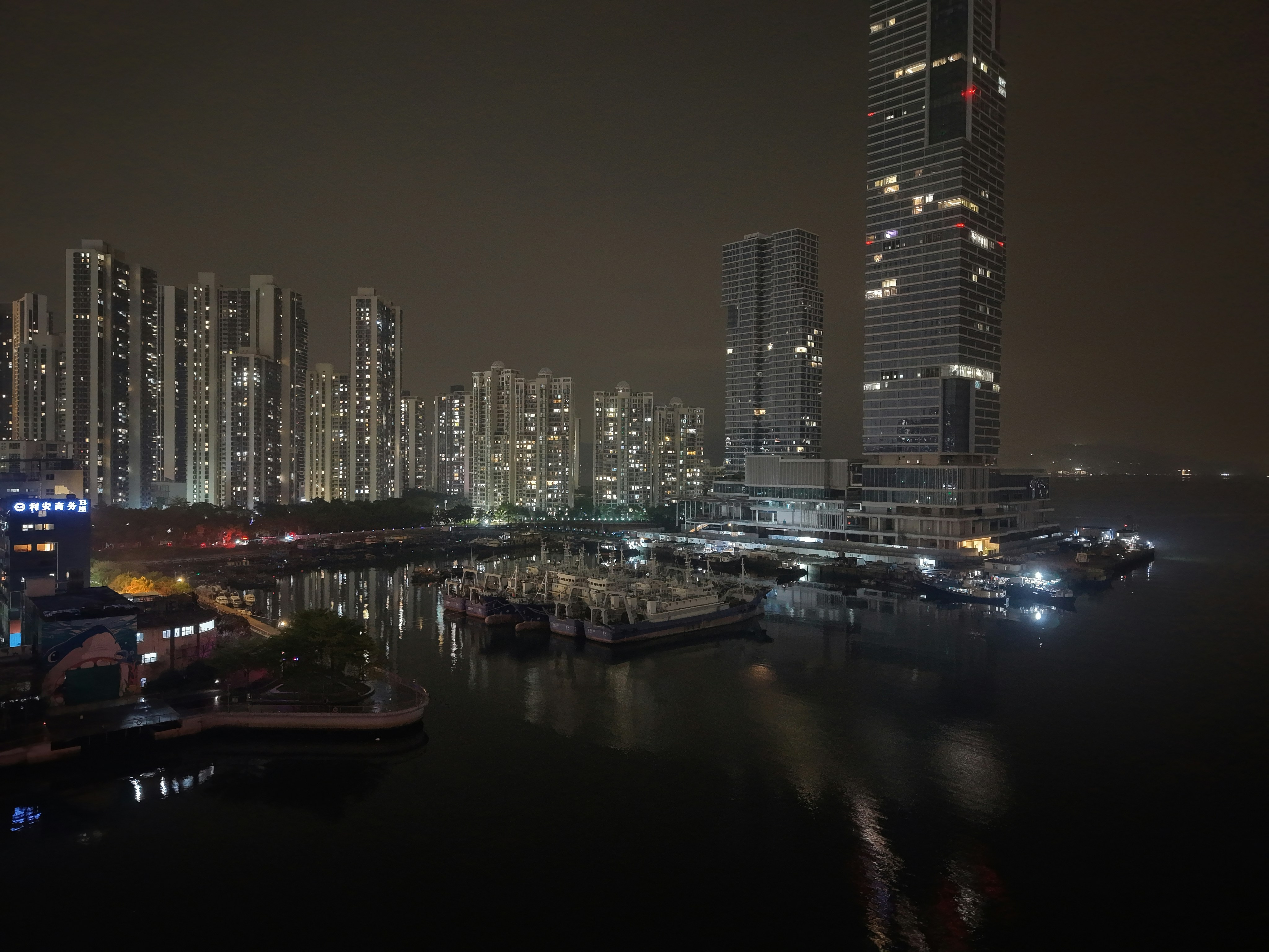 Night Harbor: Neon Reflections Along a Quiet Marina