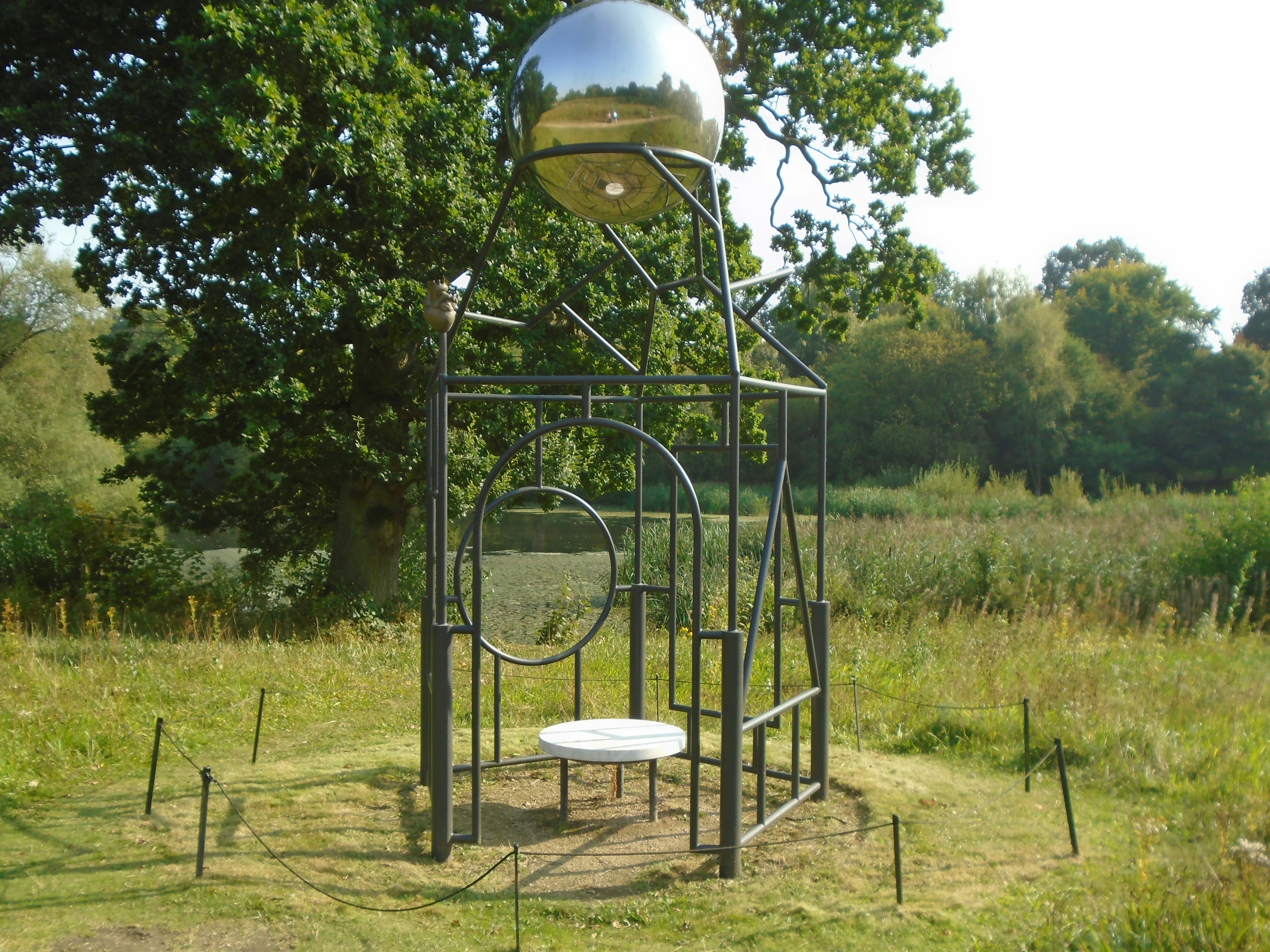 Spherical Echoes: A Metal Sculpture Under Open Sky