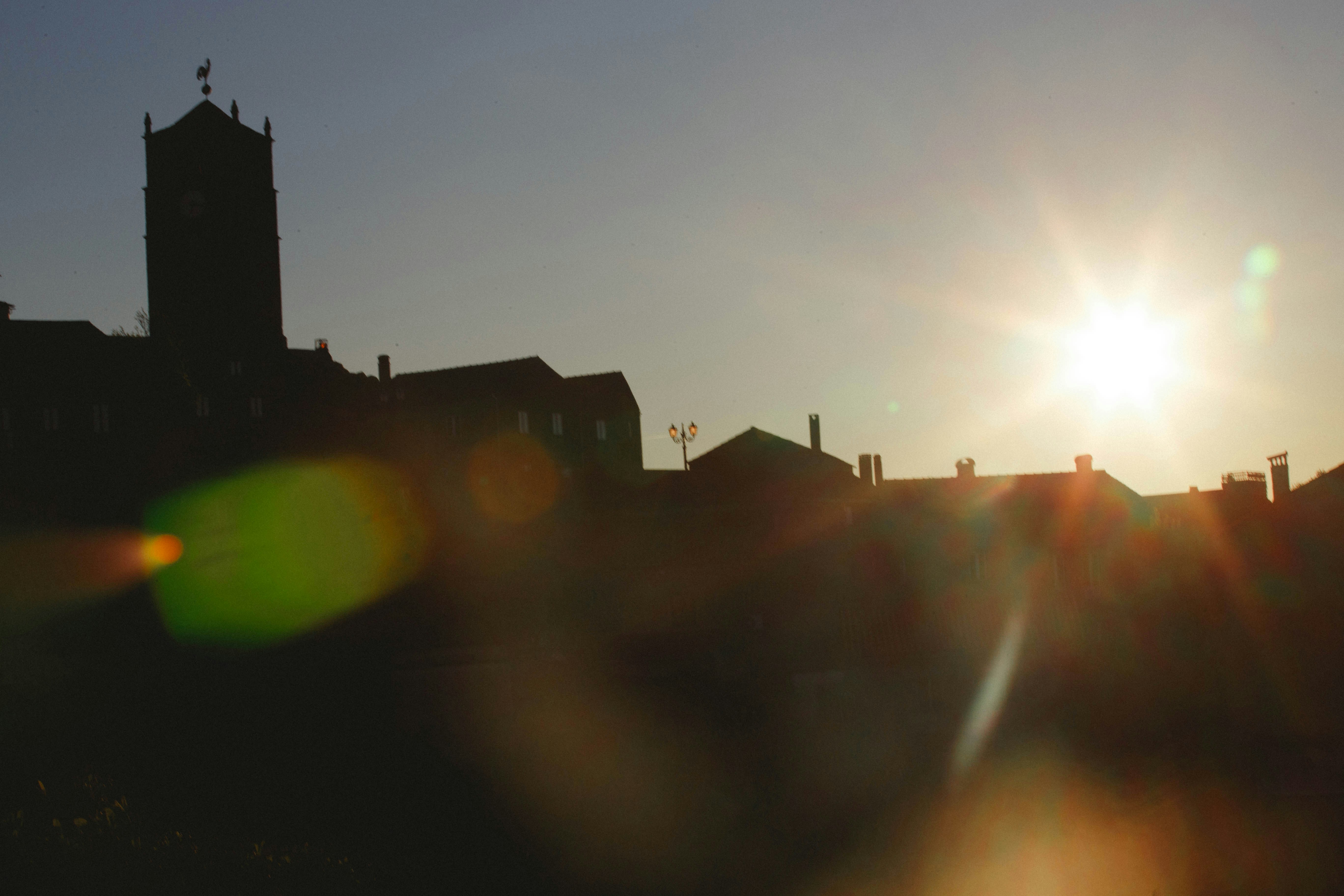Sunlit Silhouette Over a Timeless City Edge