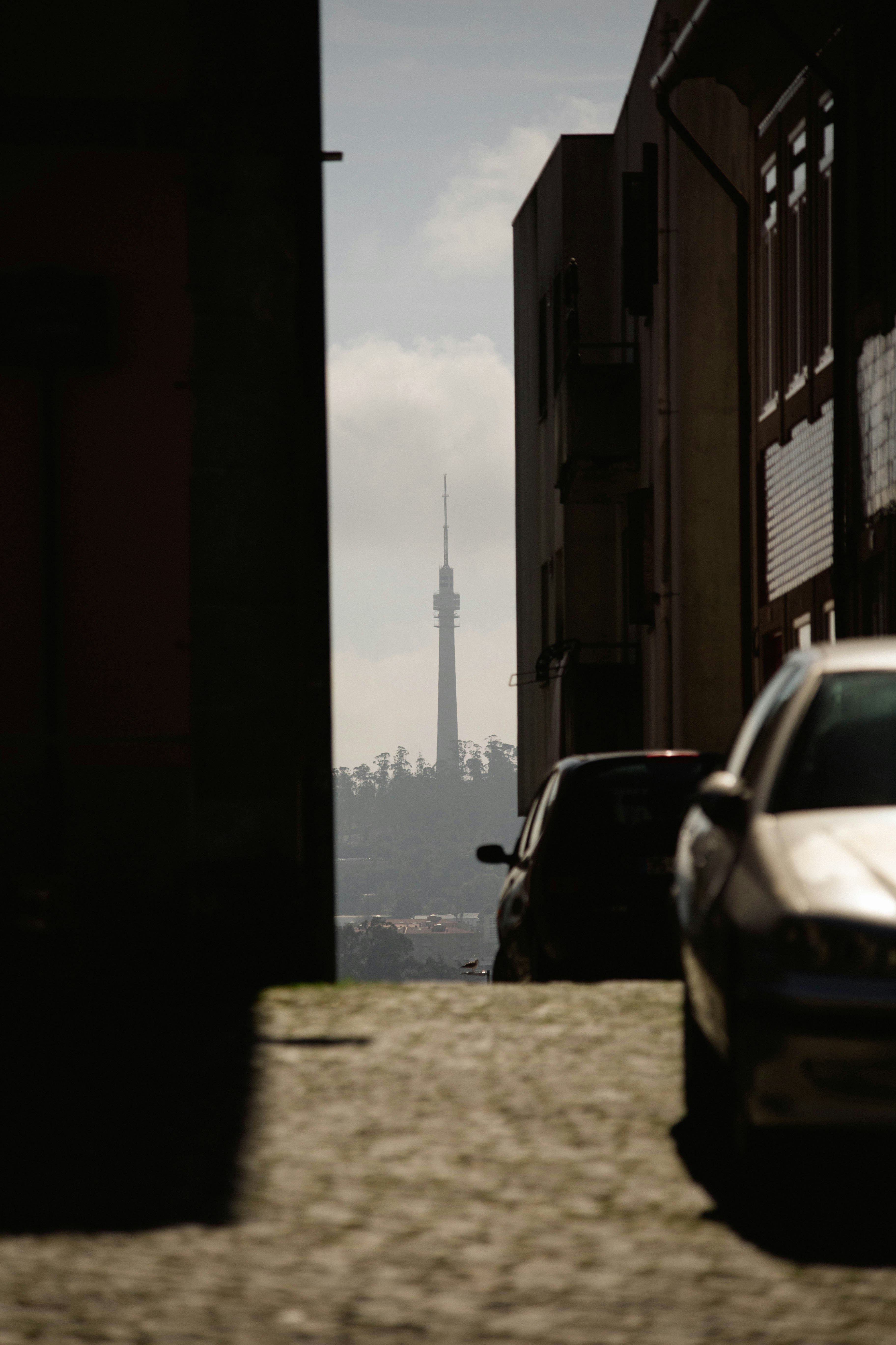 Tower in the Alley: City Frame with Skyline Hint