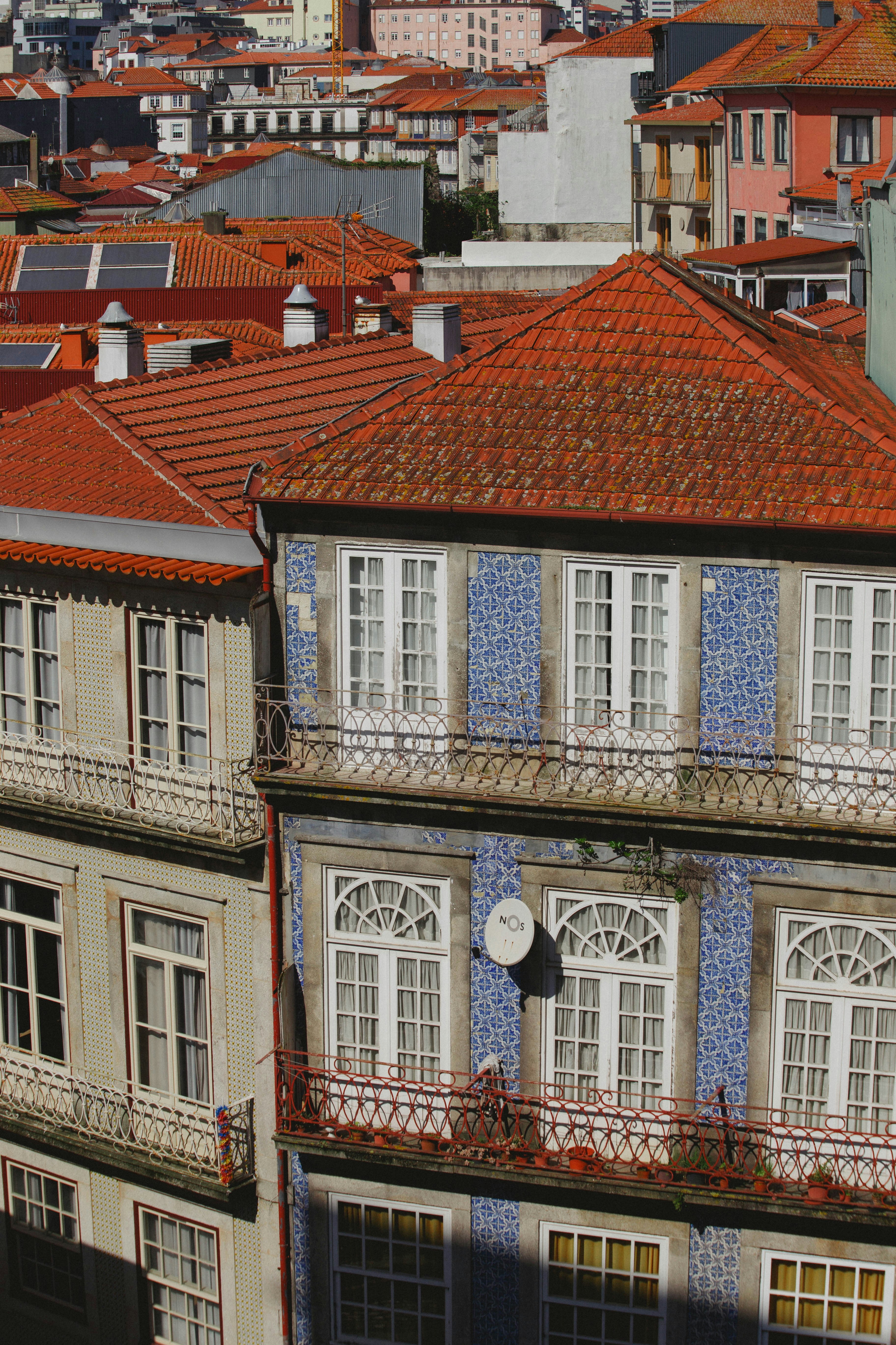 Terracotta Rooftops and Blue Ceramic Facades in Lisbon