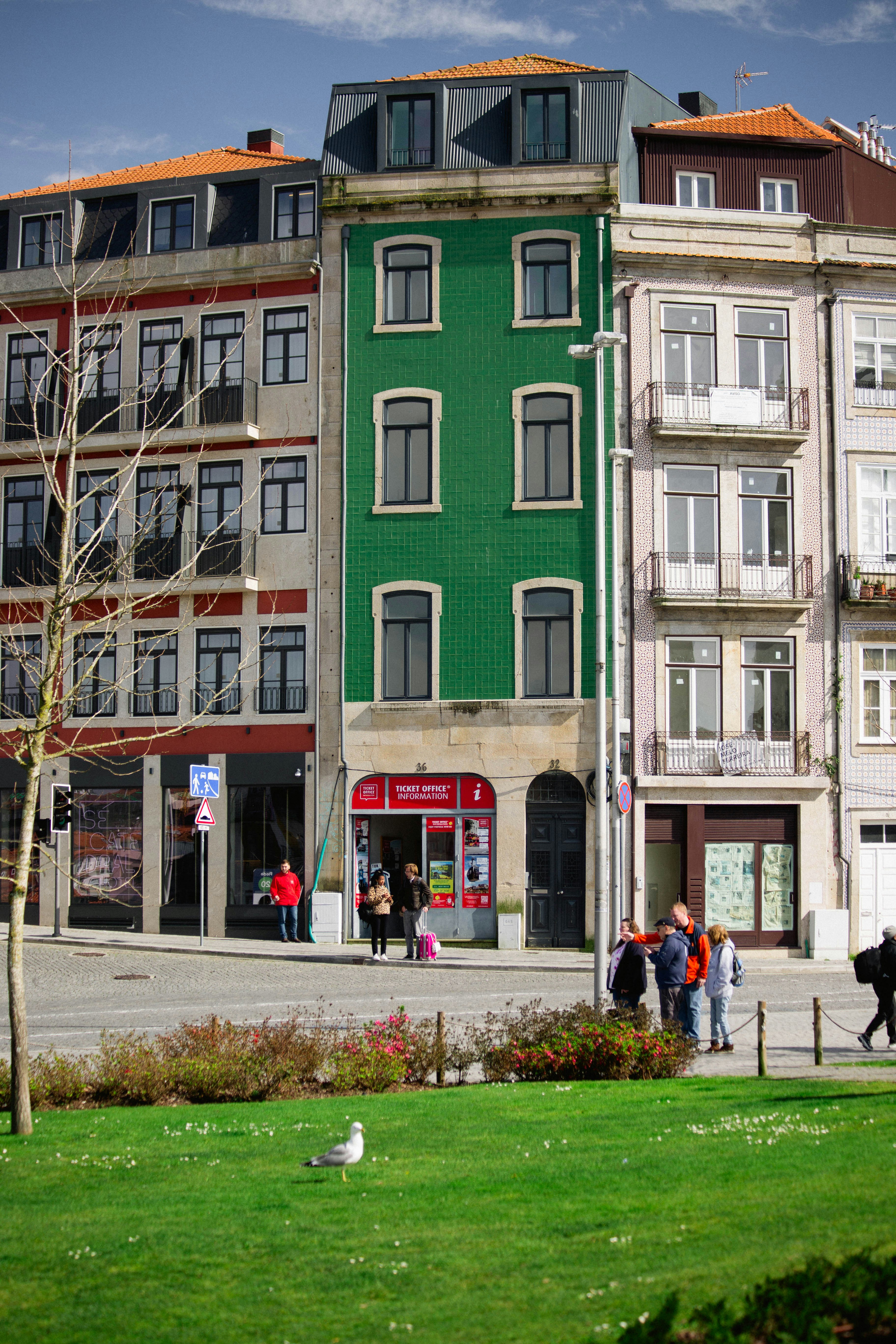 Green-tiled House on a Bustling Lisbon-esque Street