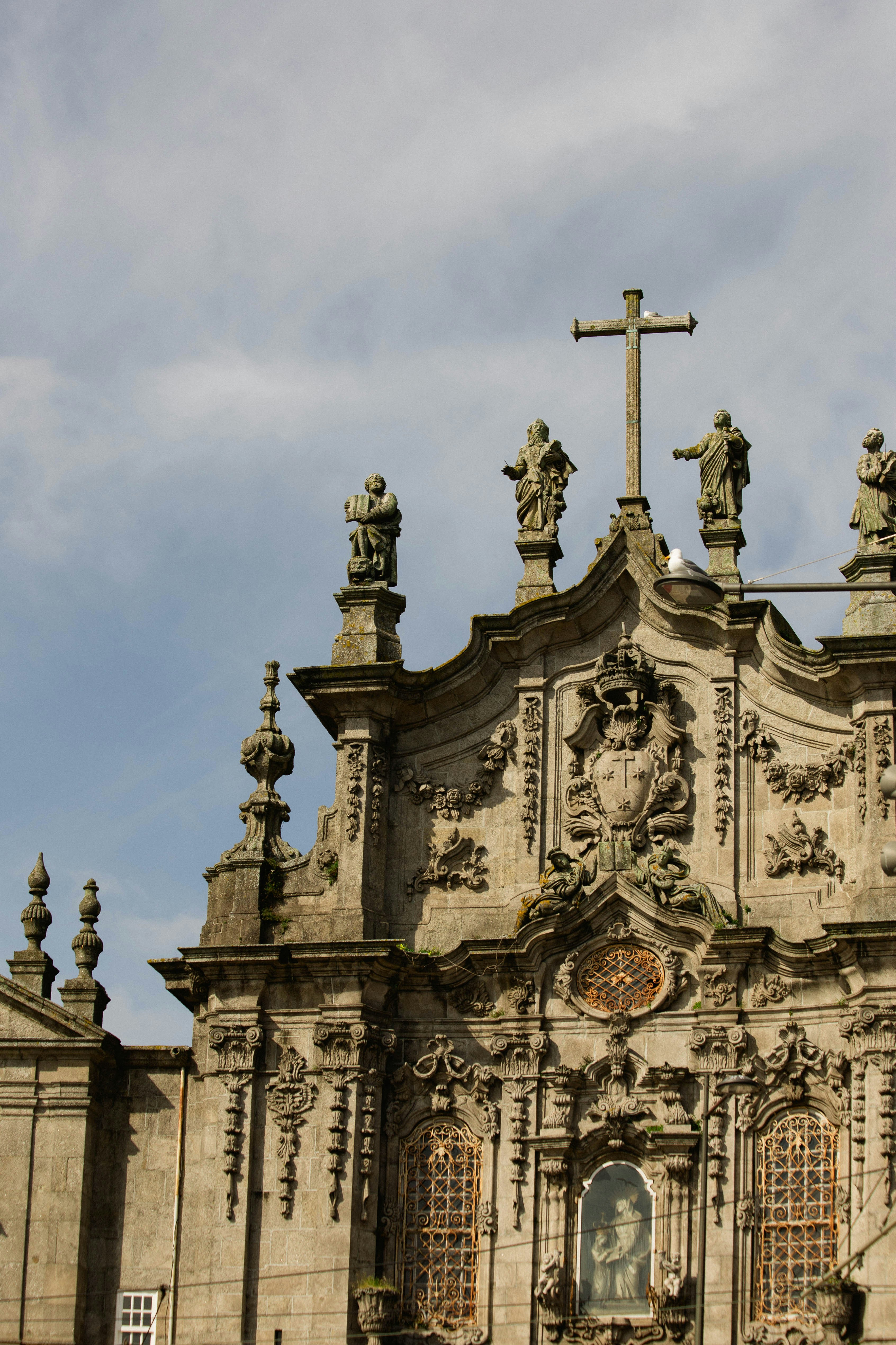 Baroque Façade of a Cathedral Crowned by Sculpted Saints and a Cross