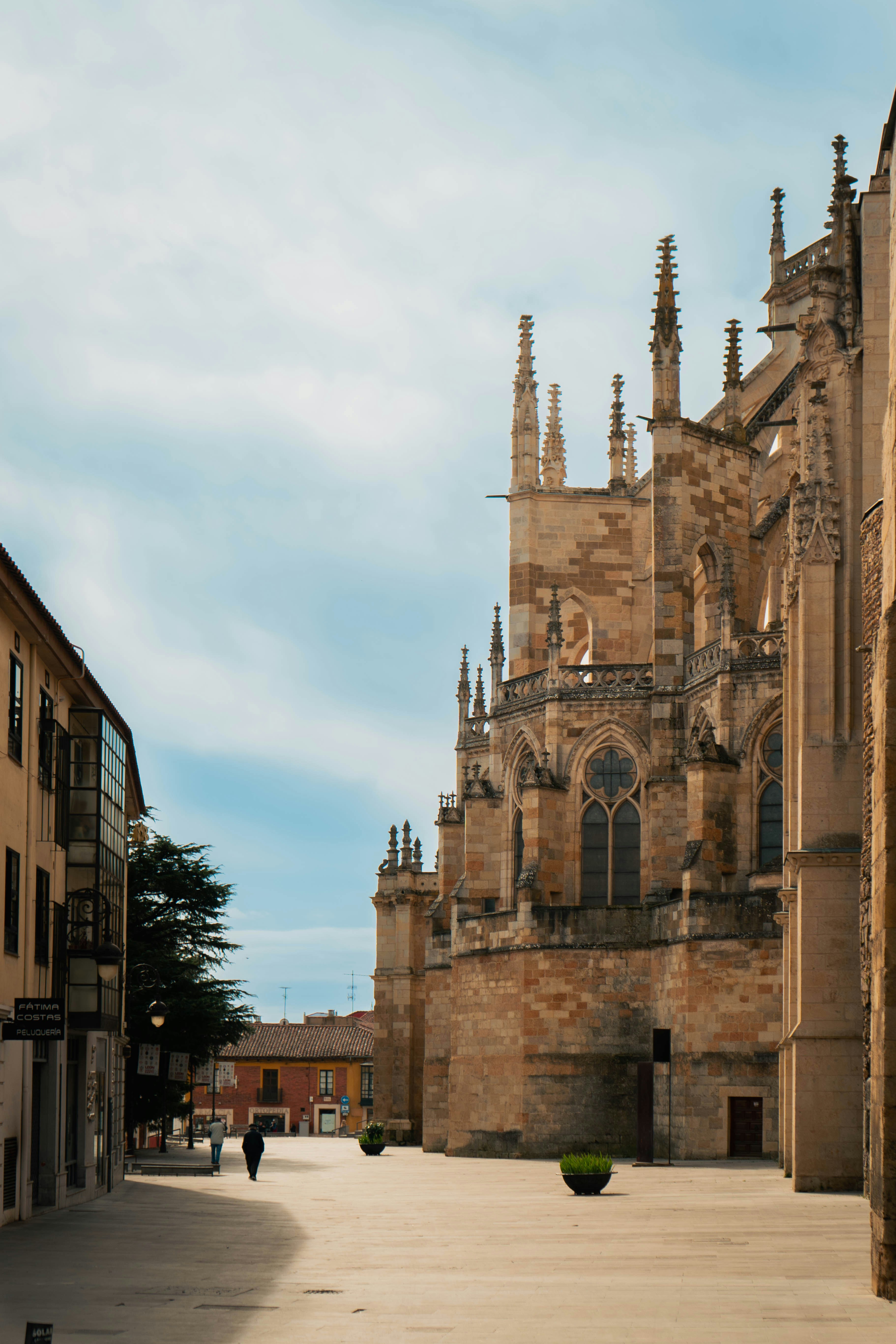 Silent Arcades: A Gothic Facade Looms Over a Quiet Plaza