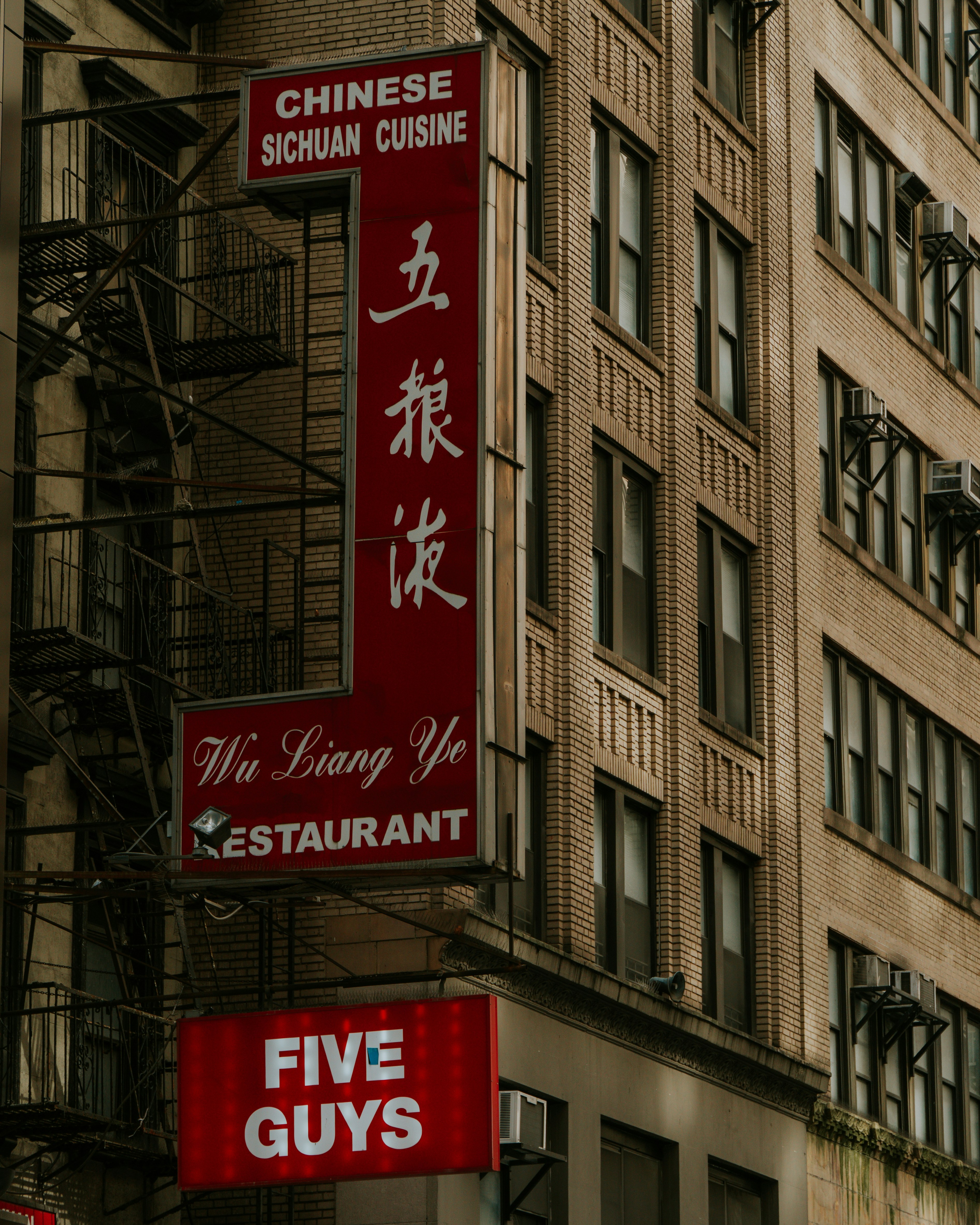 Urban Signage Tango: Five Guys Meets a Chinese Restaurant in Brick and Fire Escape Light