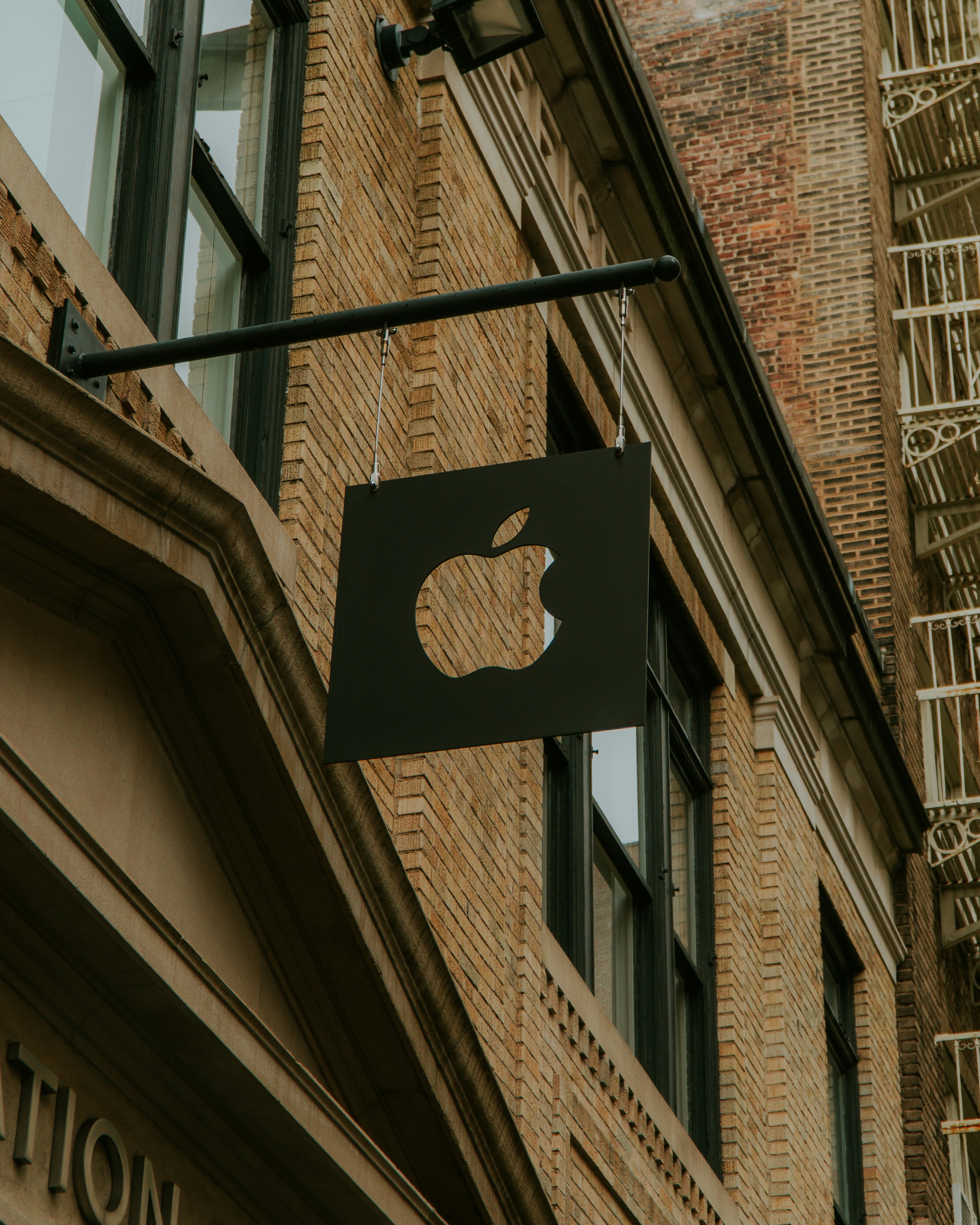Apple Signage on a Brick Urban Facade