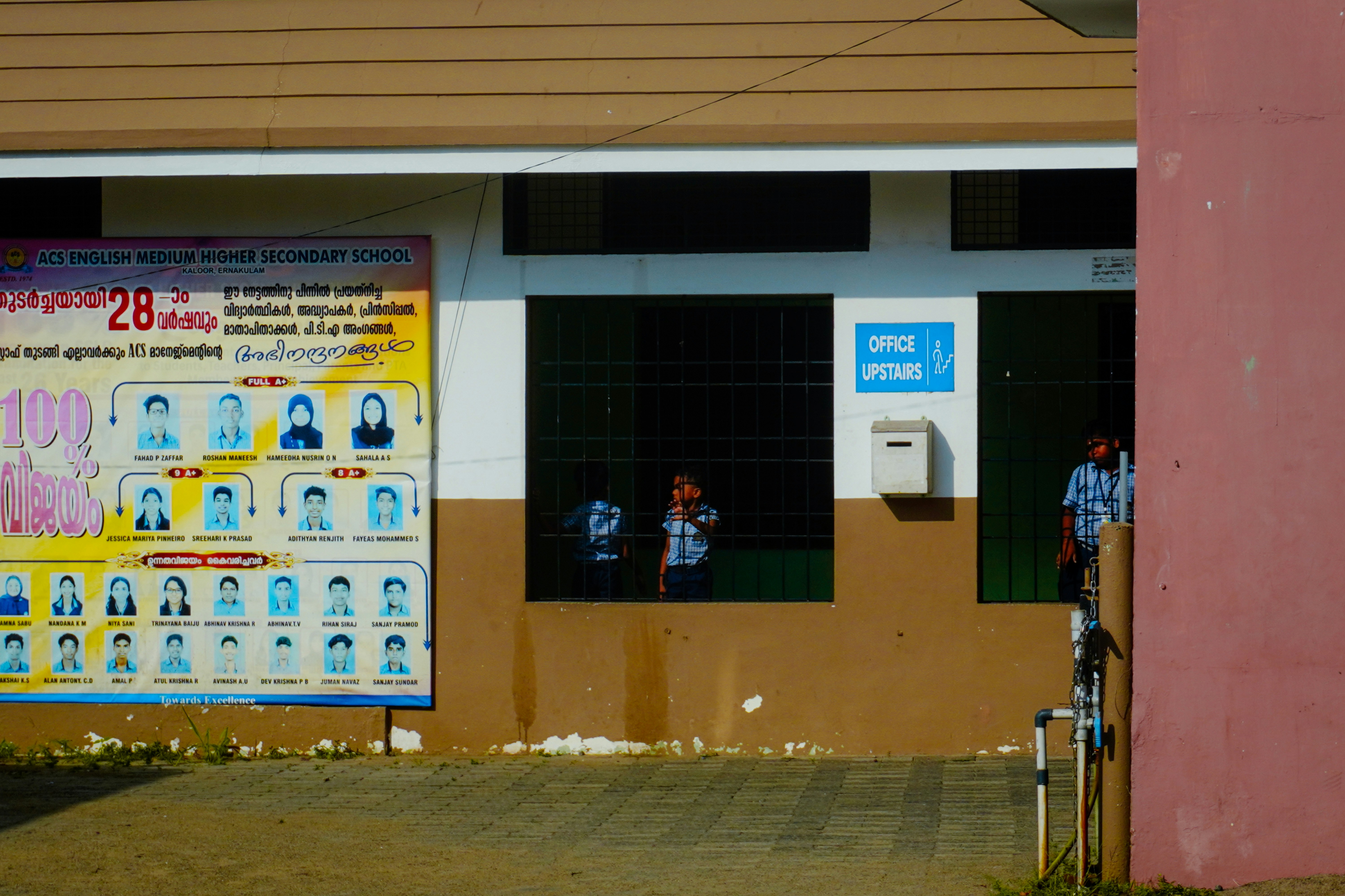 Schoolyard Silence: Posters, Windows, and a Quiet Corridor