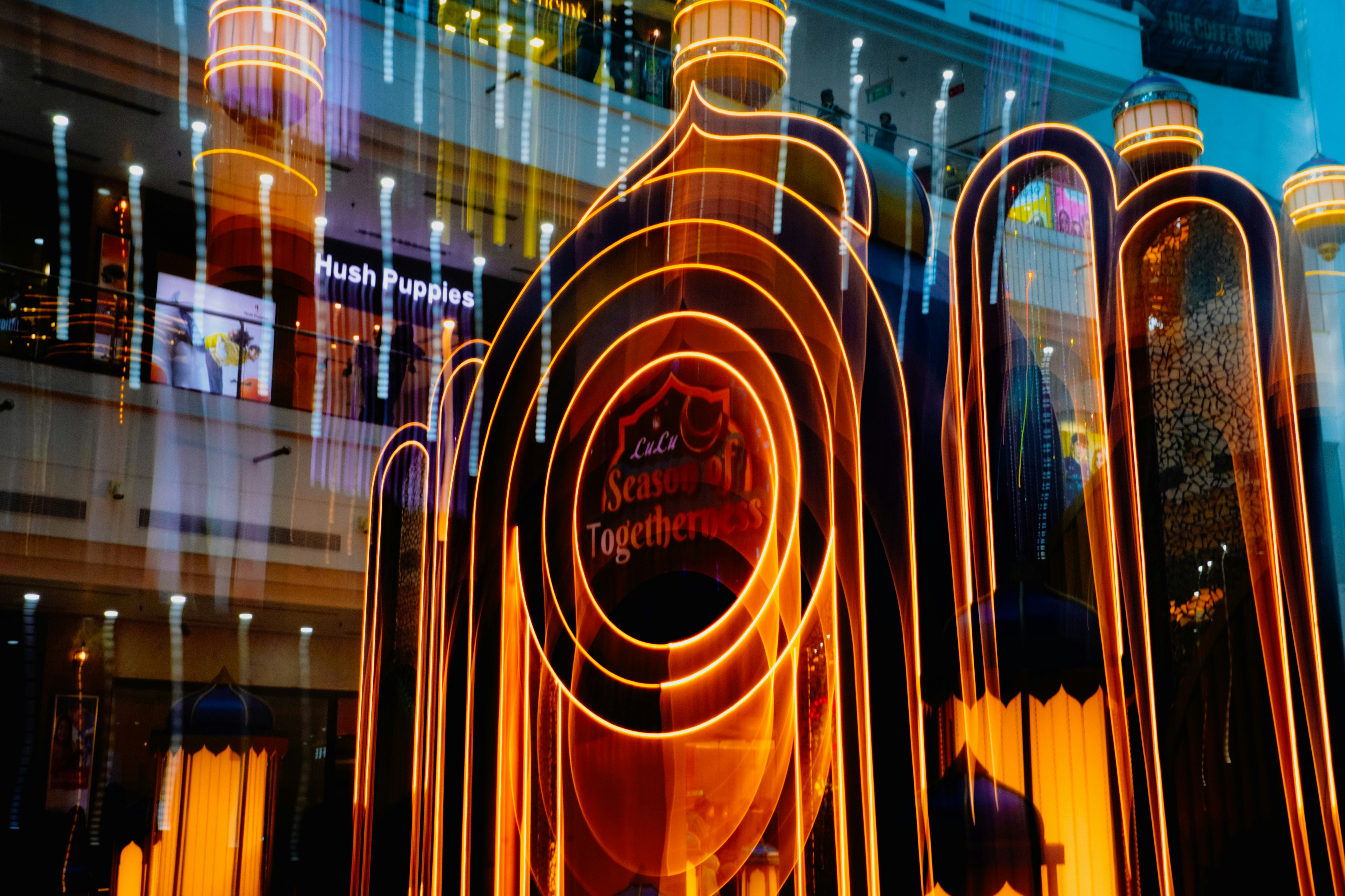 Neon Rhythm: Circular Light Trails Framing a Mall Window Display
