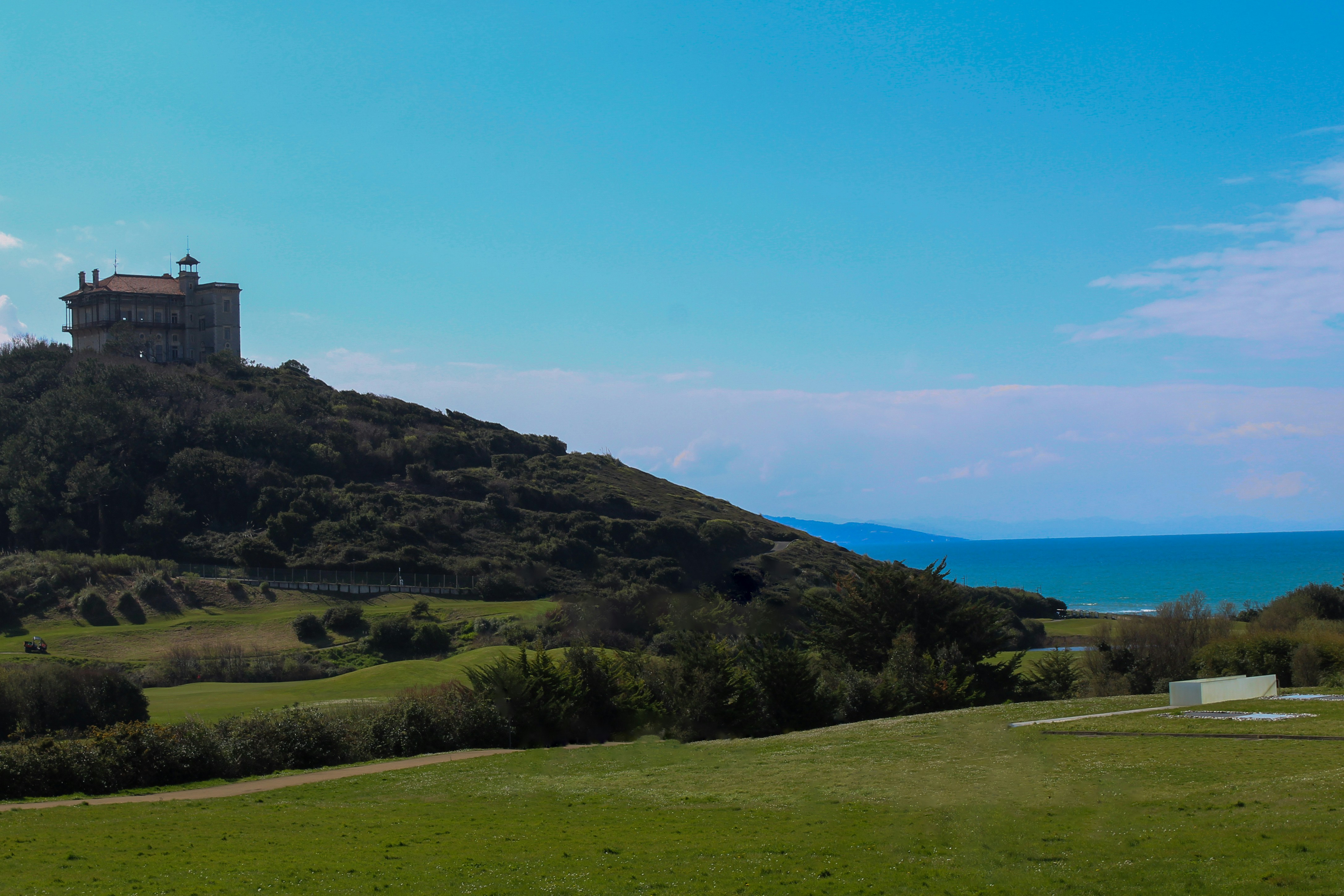 Castle on the Hill: Coastal Green and Blue Vista