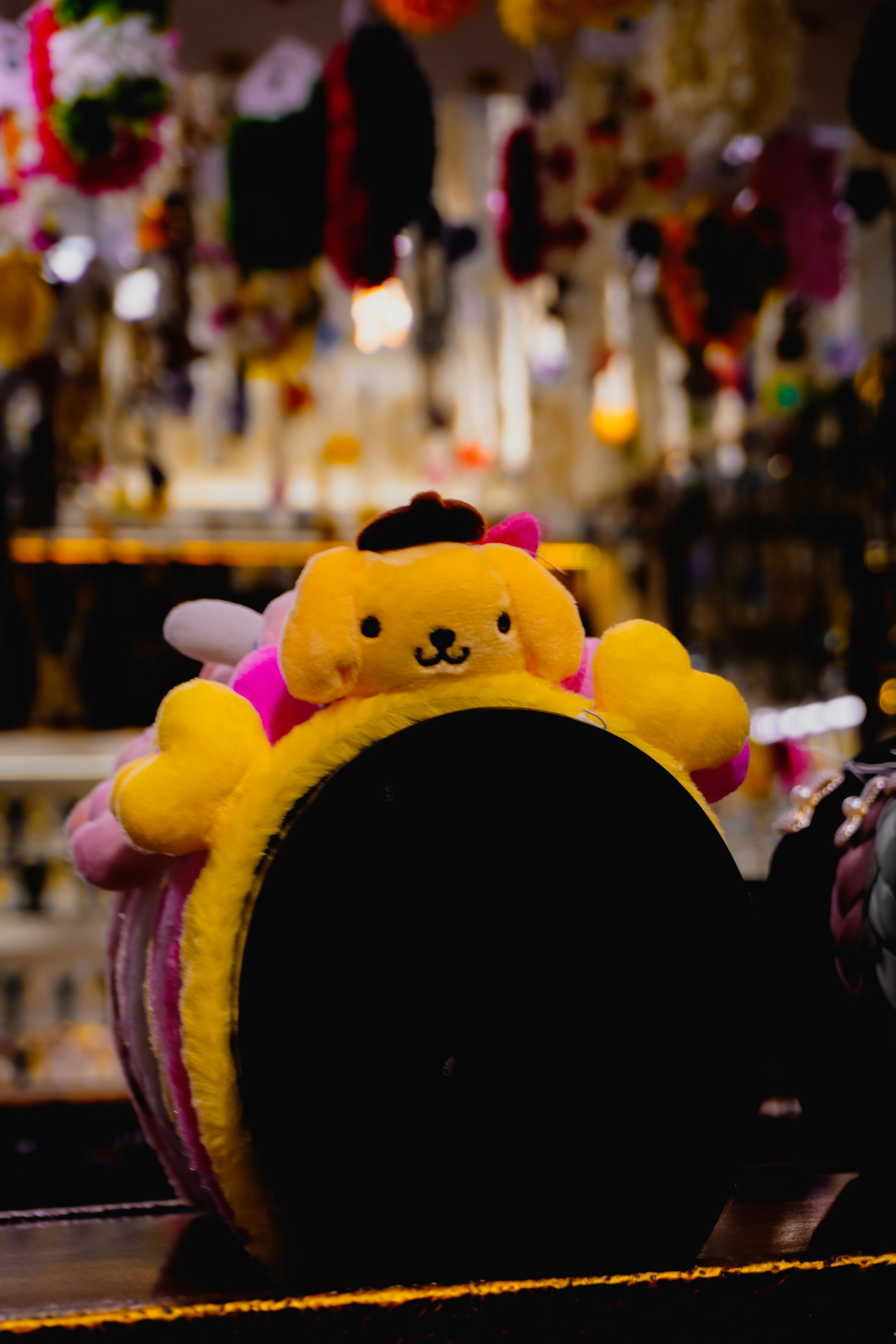 Center Stage Plush: A Yellow Beaming Cute Octopus in a Hobby Shop Window