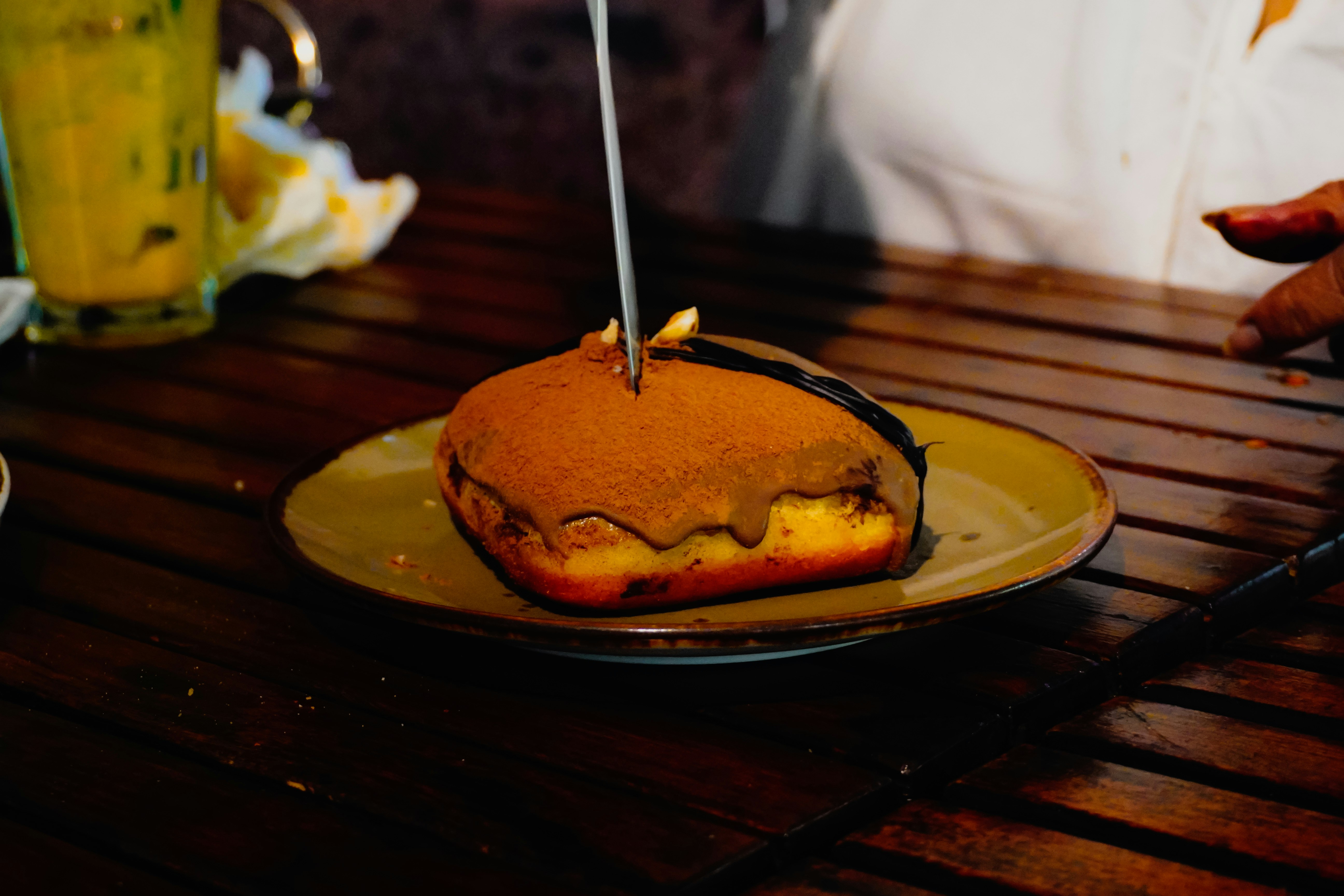 Candlelit Donut Surprise on a Dark Wooden Table