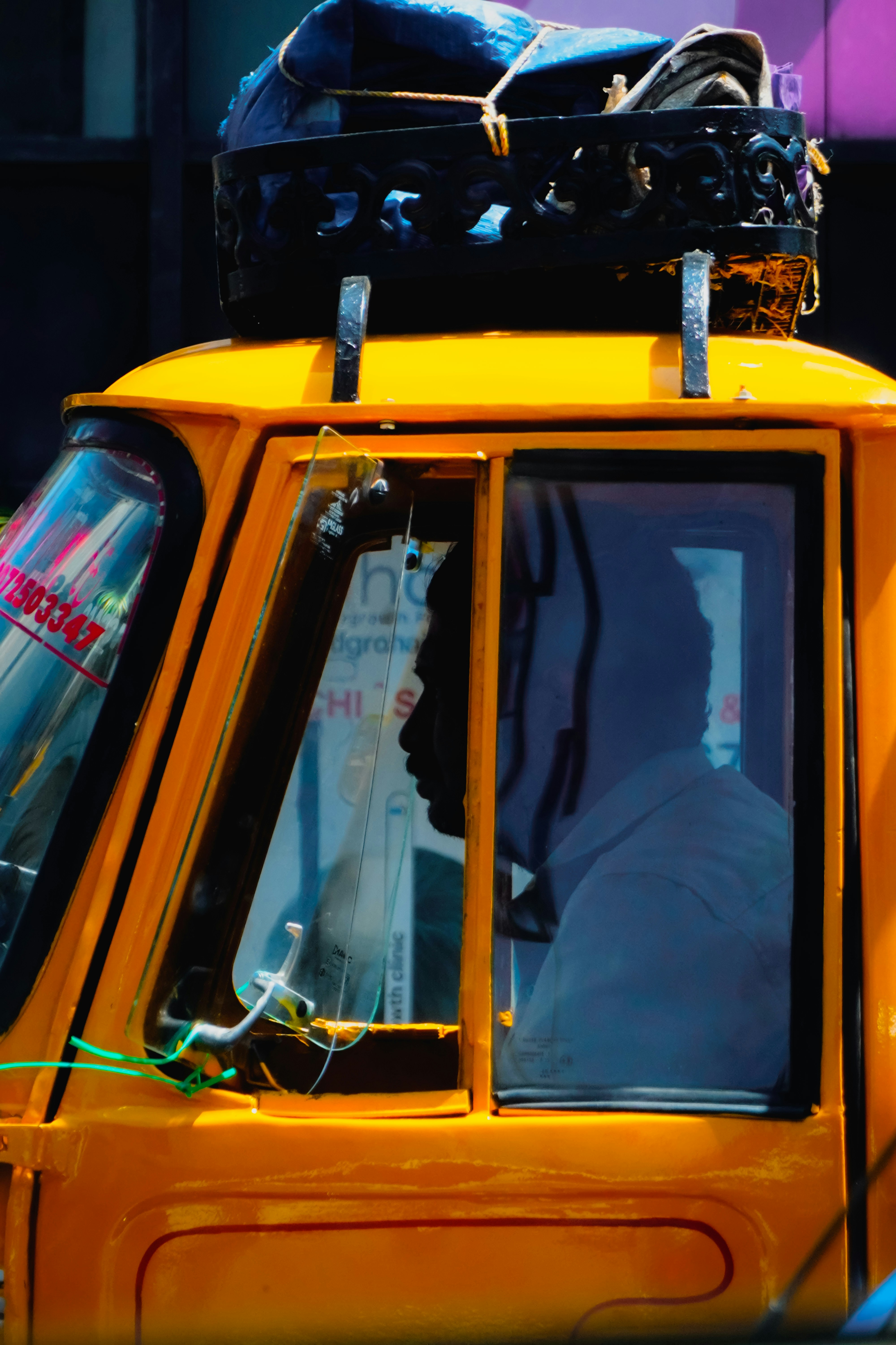 Cabin Window Conductor: A Street Taxi’s Quiet Portrait