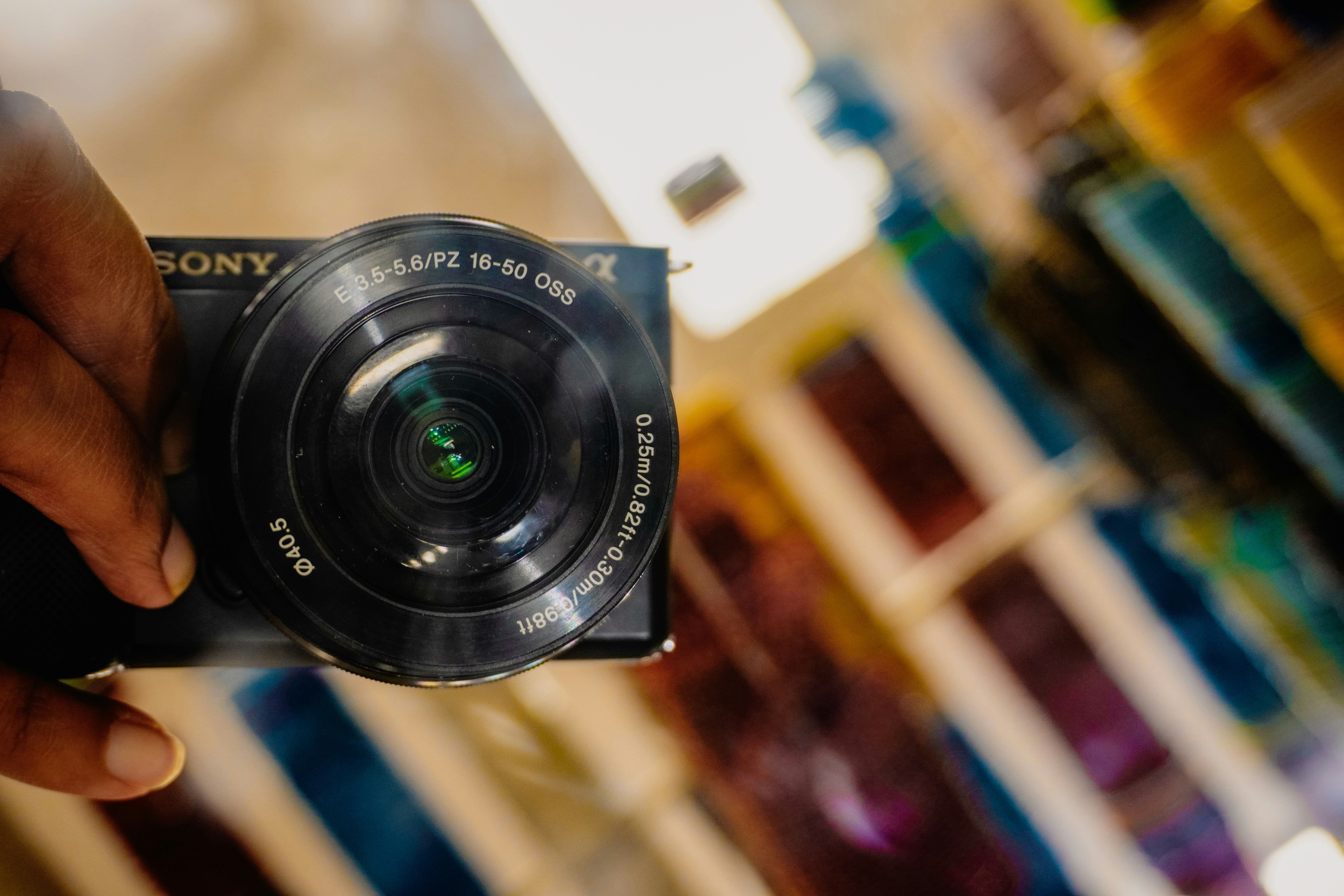 Sunlit Moments Through a Compact Lens