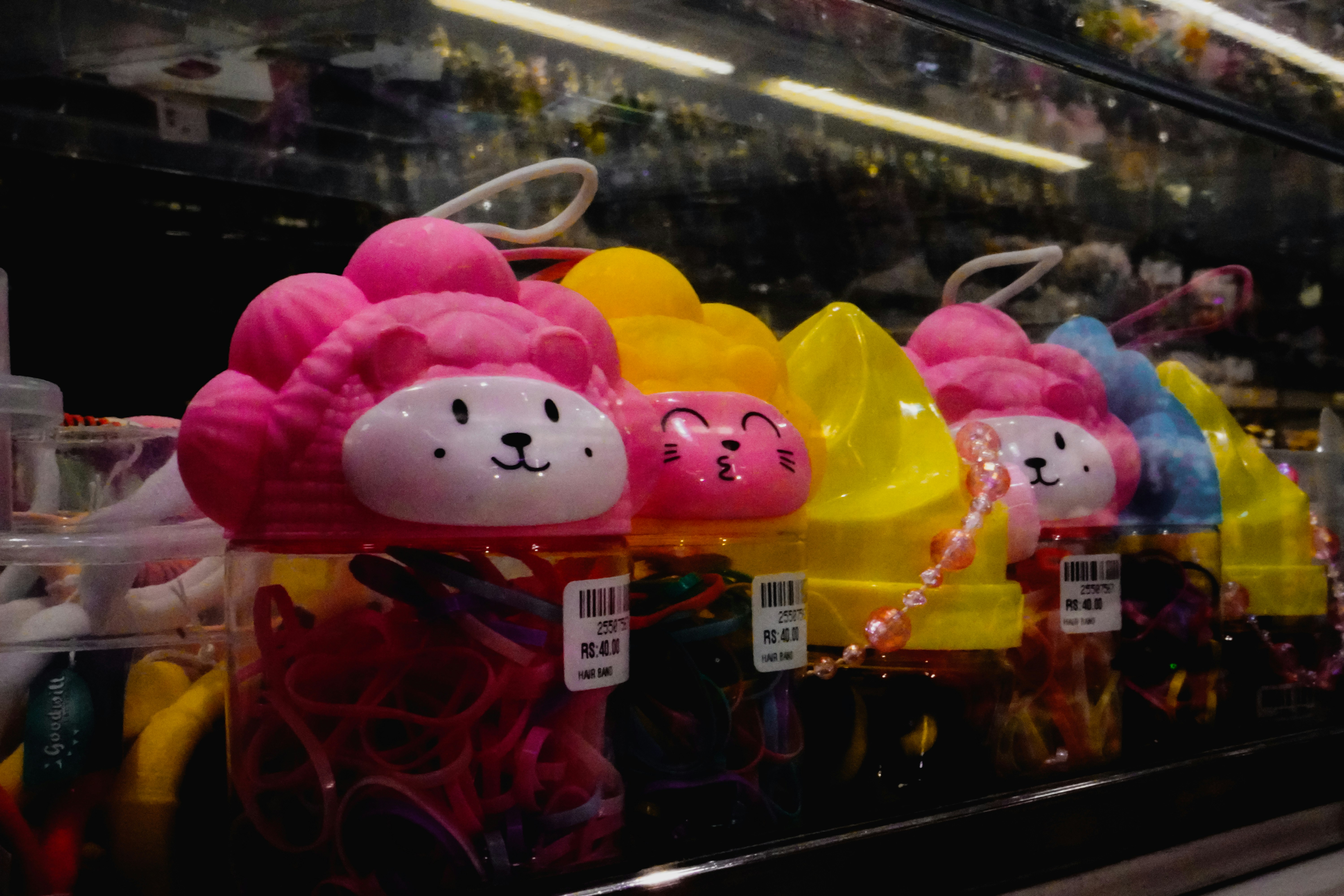 Plastic Cloud Sailors: Colorful Plush Keychains in a Store Window