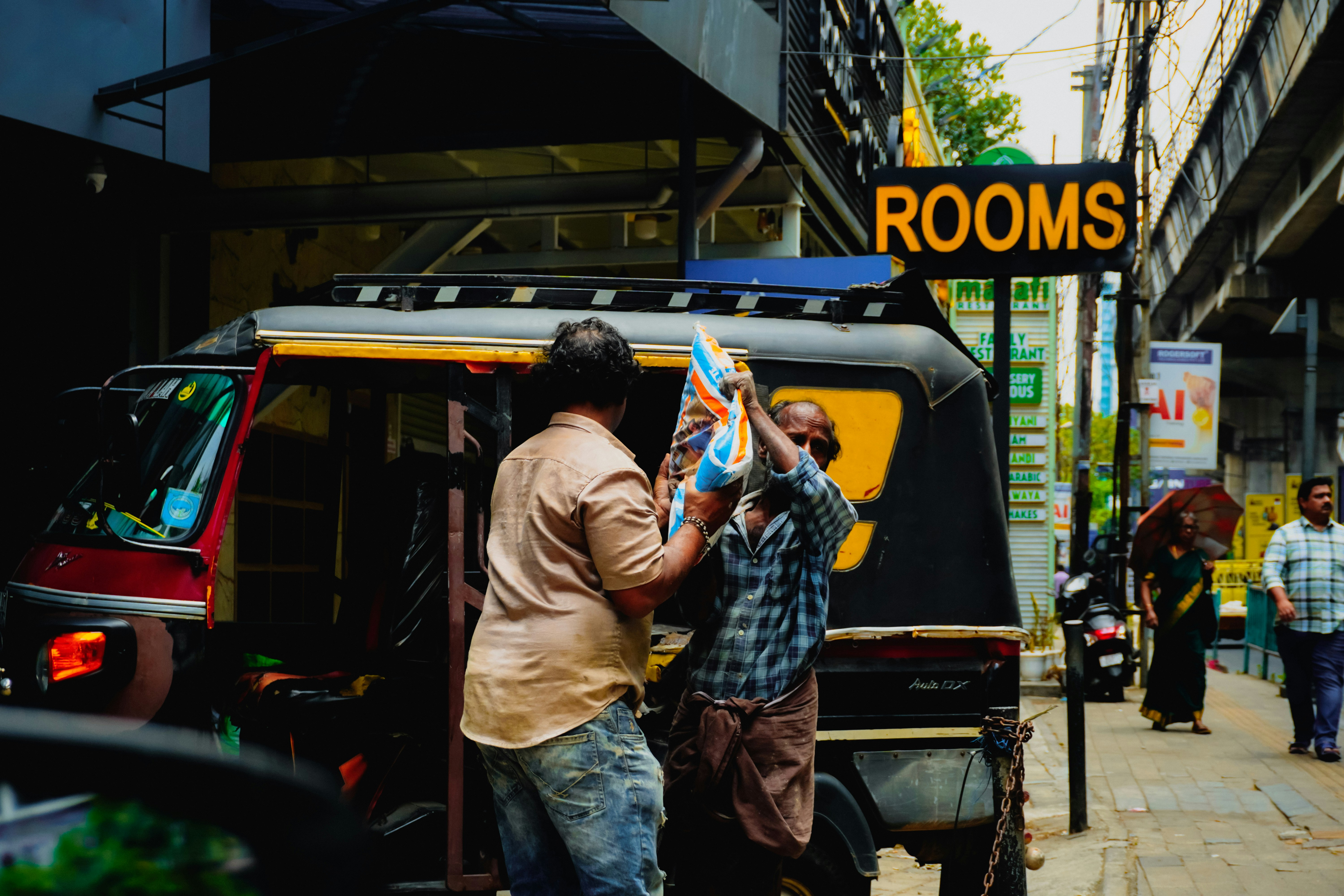 Trading a Towel in the Alley: A Street Scene at a Bustling Corner
