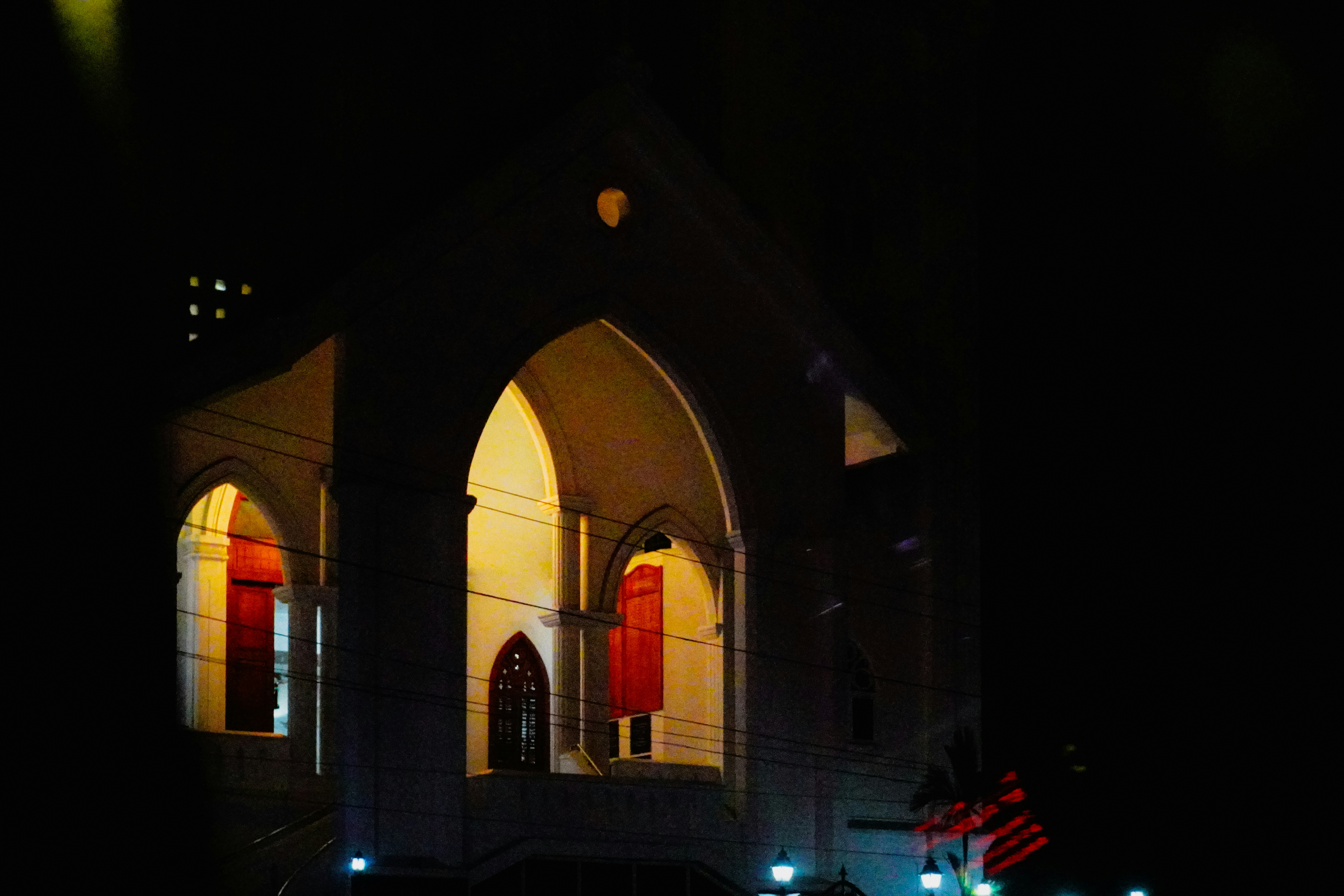 Arched Cathedral Windows Amid Nightfall