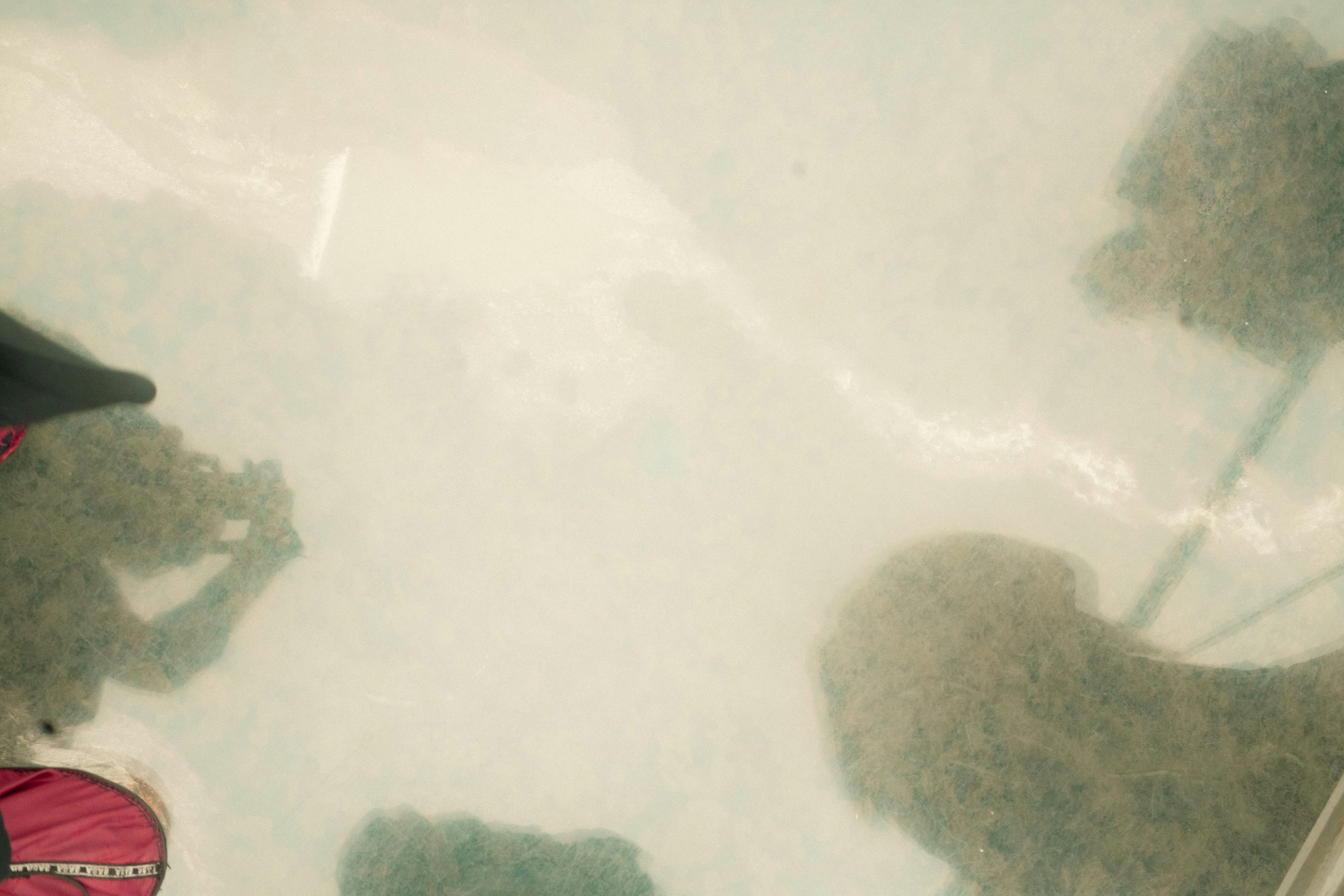 Shadows on a Glassy Surface: Submerged Moments