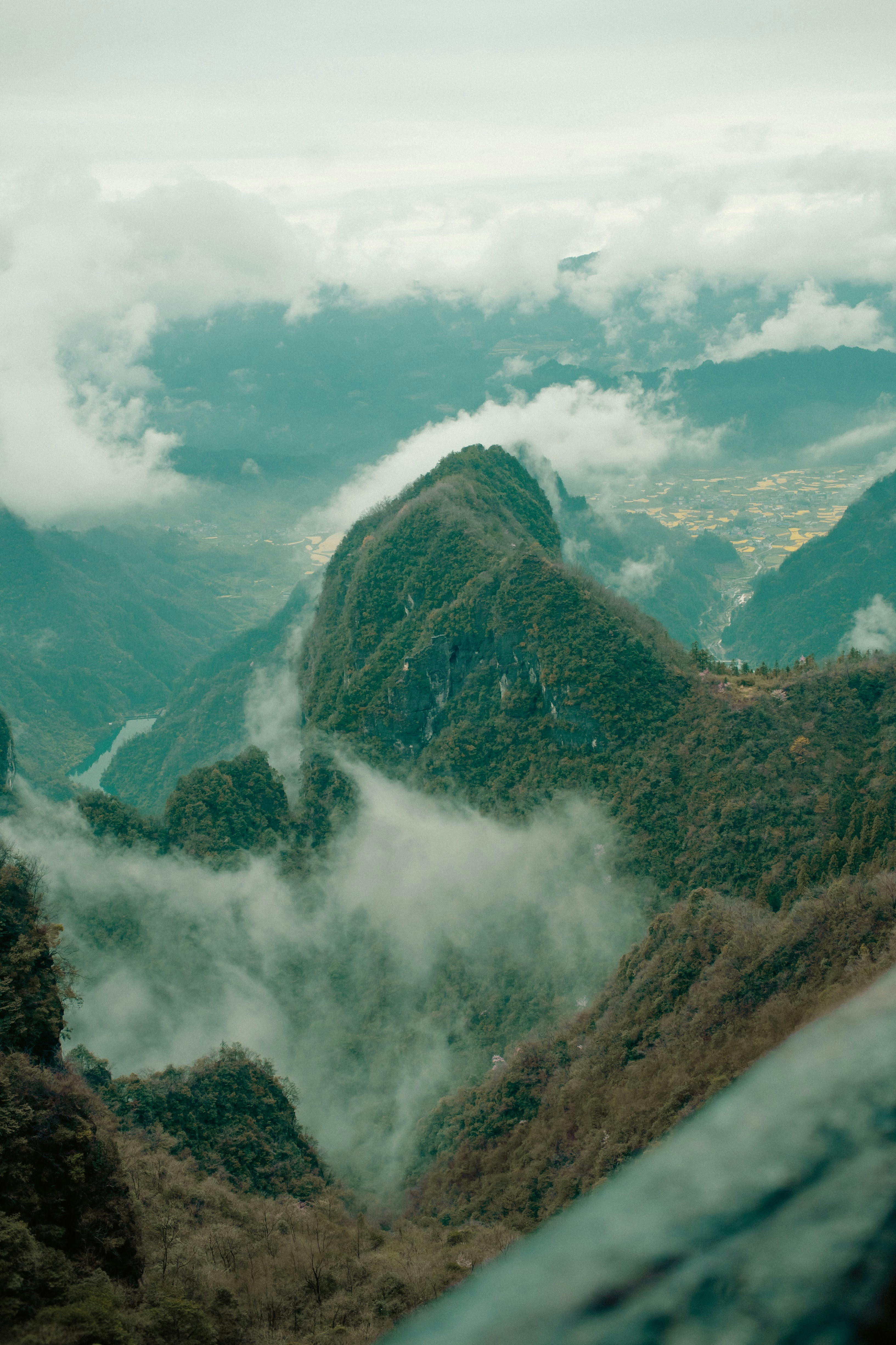 Misty Peak: Clouds Cloak a Serrated Ridge