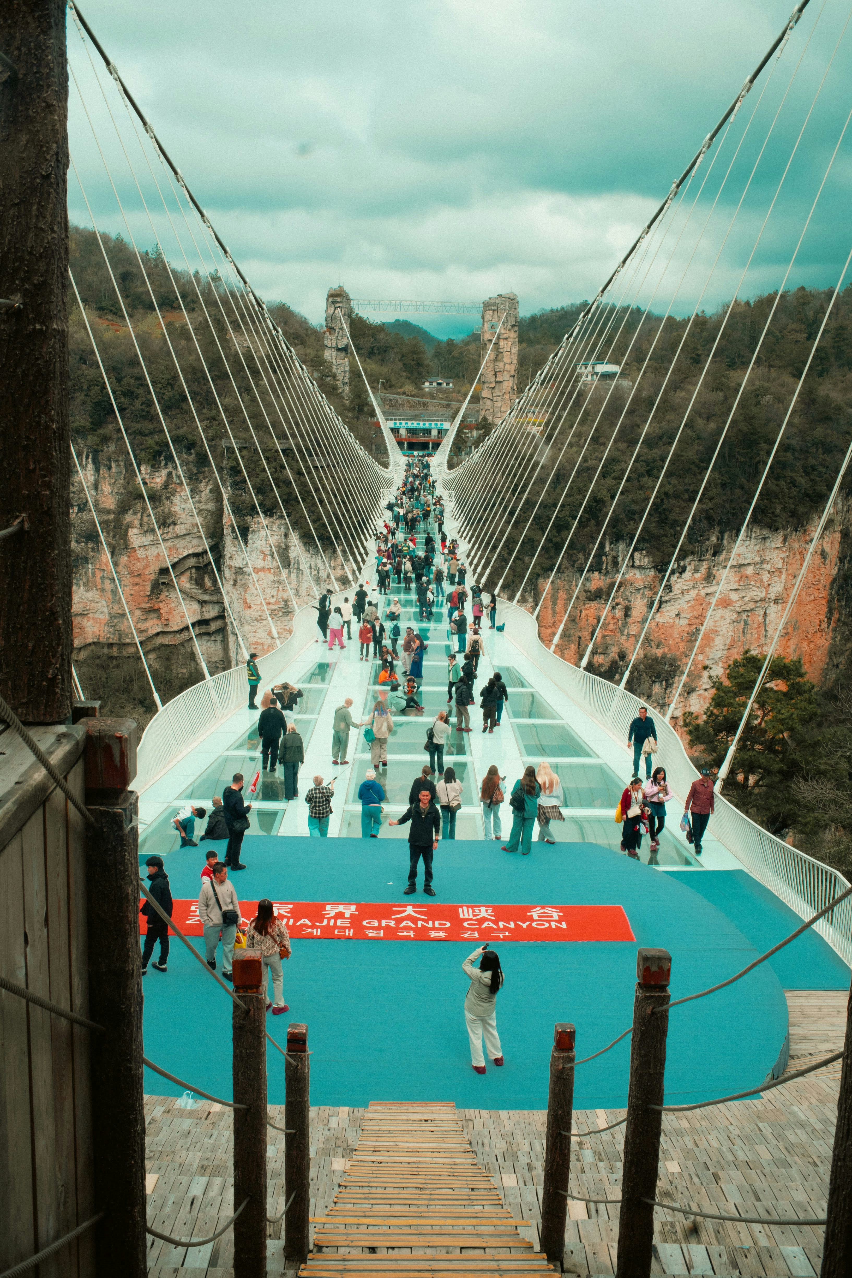 Crowded Glass Pathway Crossing the Grand Canyon