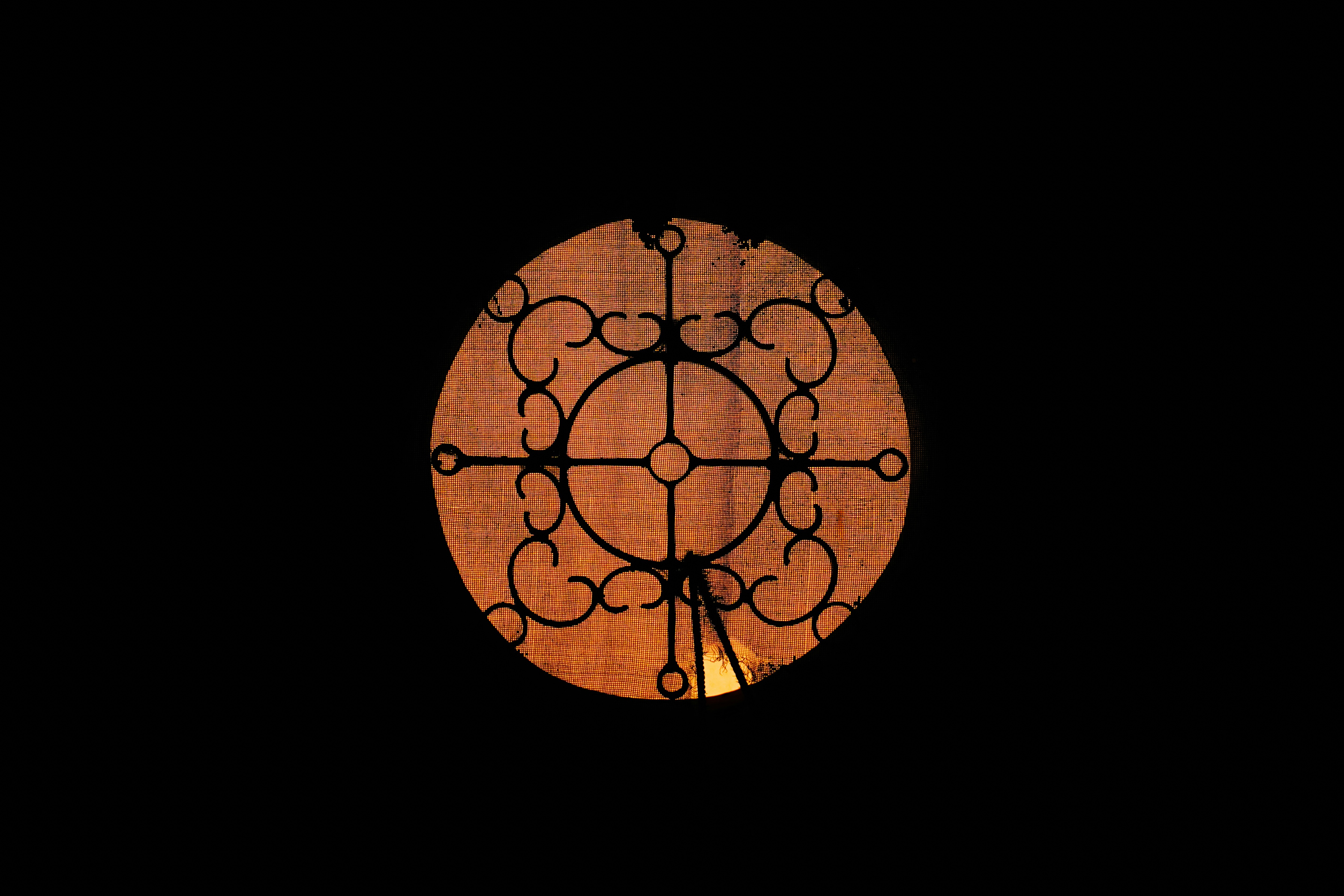 Circular Ironwork Silhouette Framed by Midnight Black