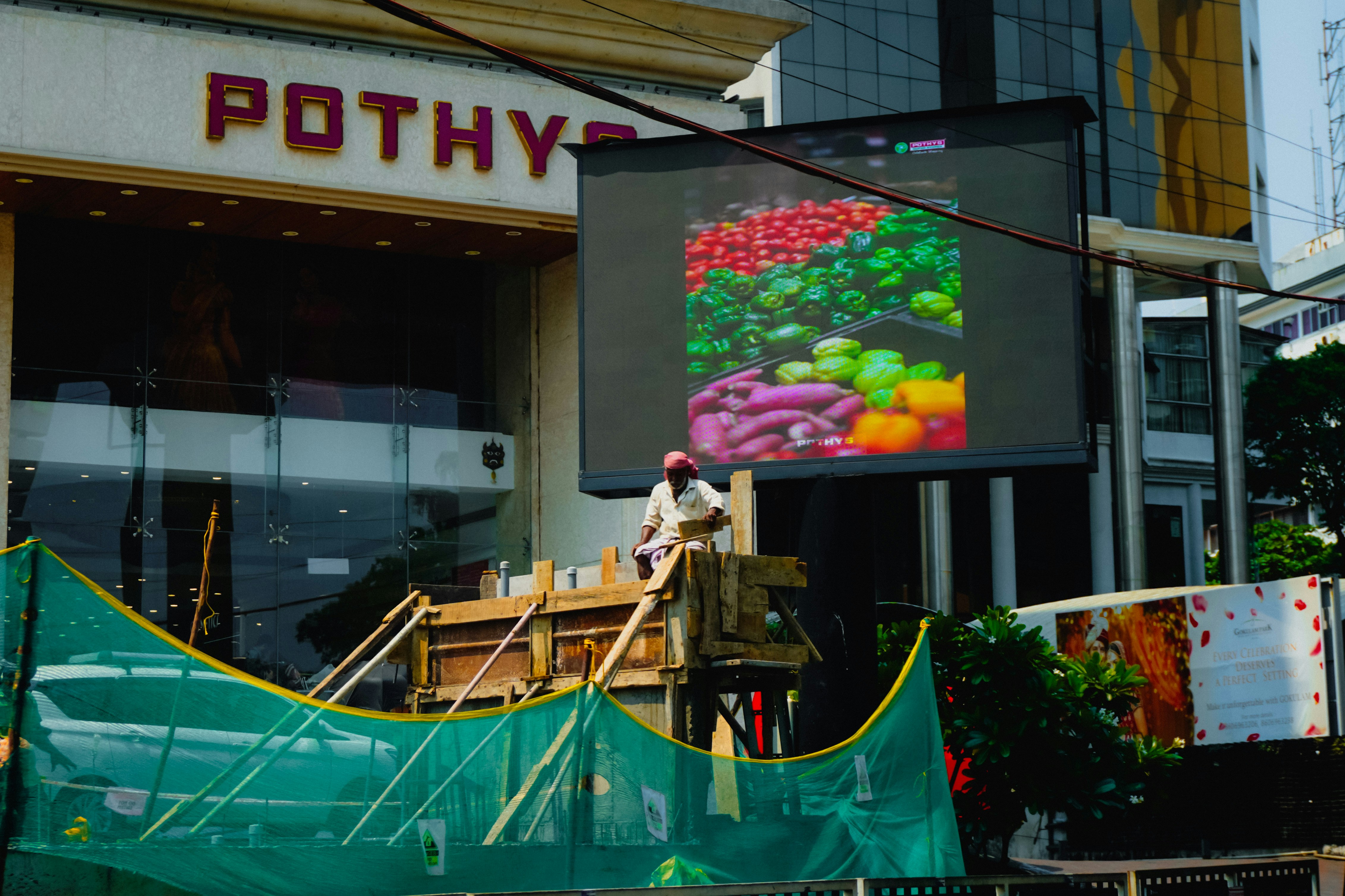 Projected Produce: A Market Screen Illuminates the City Scene