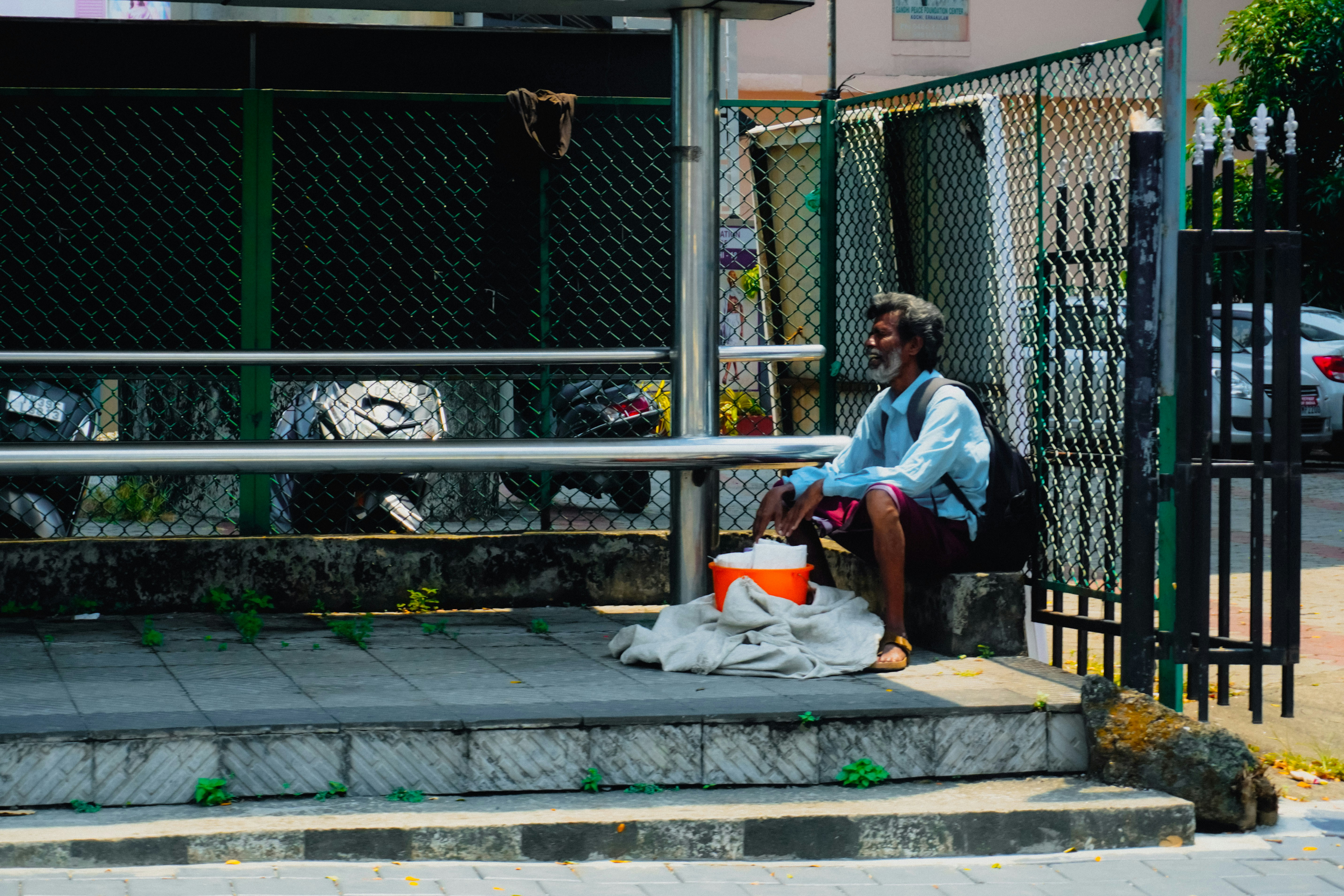The Street Pharmacist: A Quiet Moment on the Sidewalk