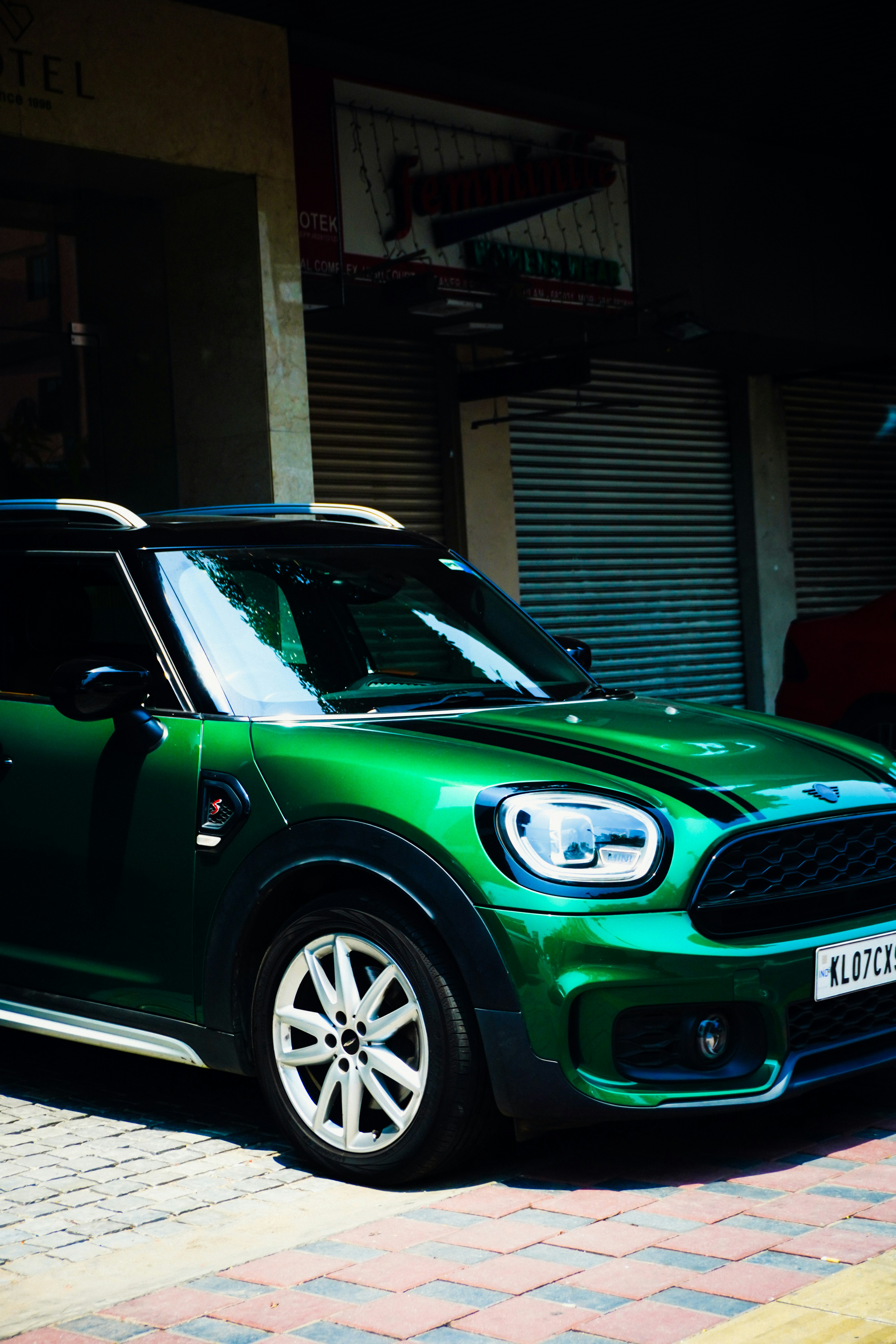 Emerald Ride: A Green Mini in Full Streetlight Glow