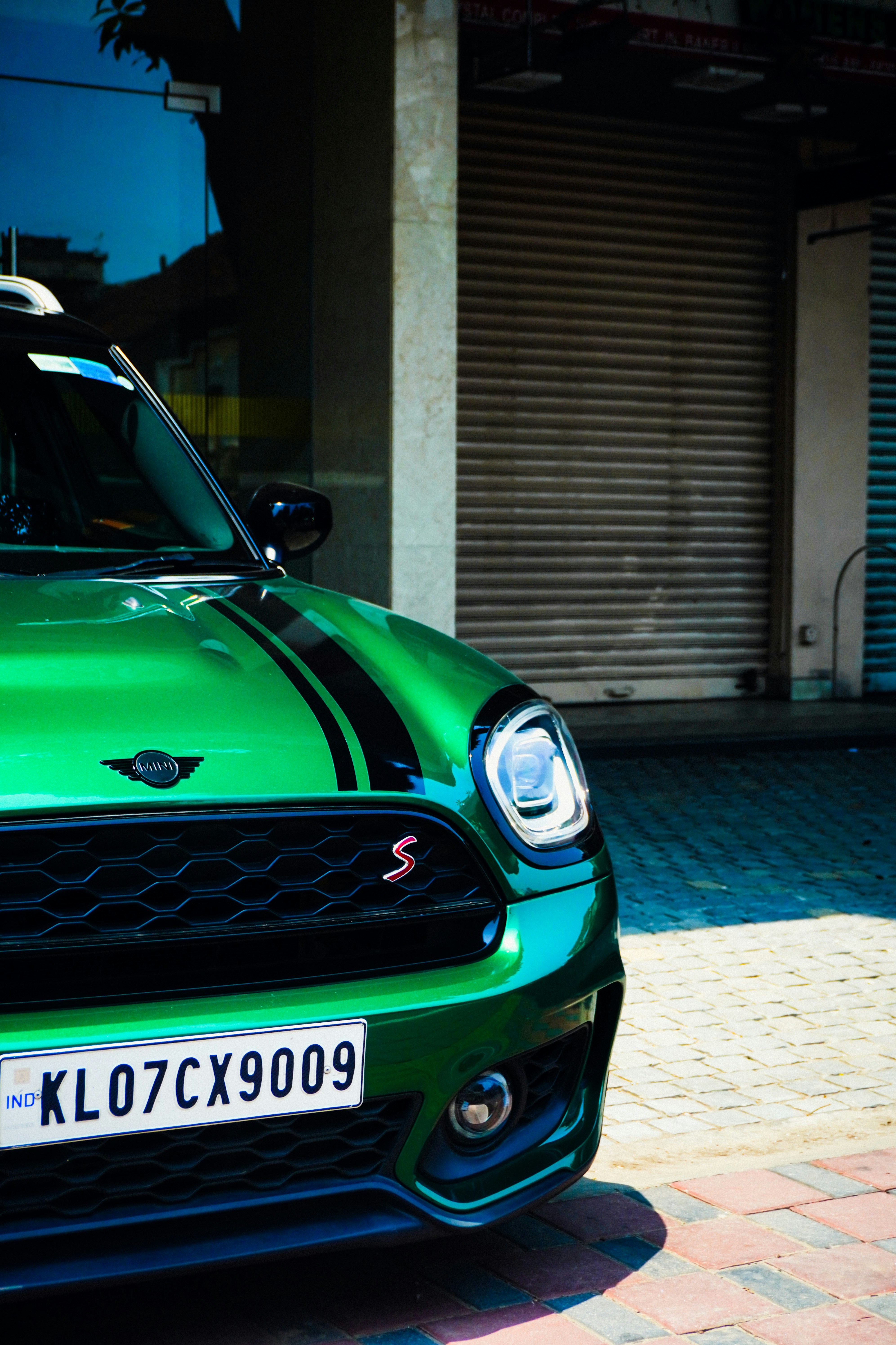 Green Mini Cooper S at the Edge of the Frame