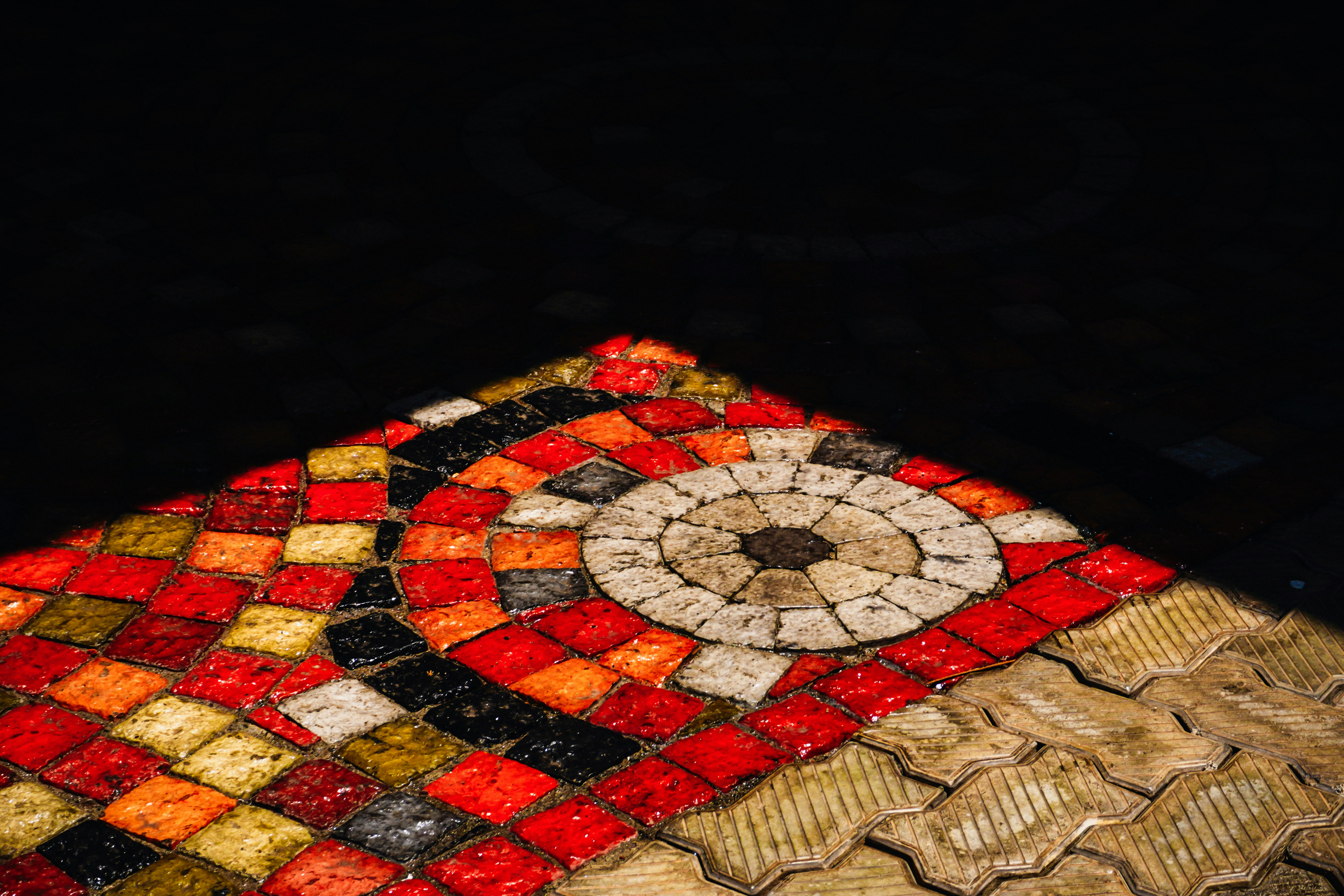Colorful Mosaic Tile Ring Anchored by a Circular Central Pattern